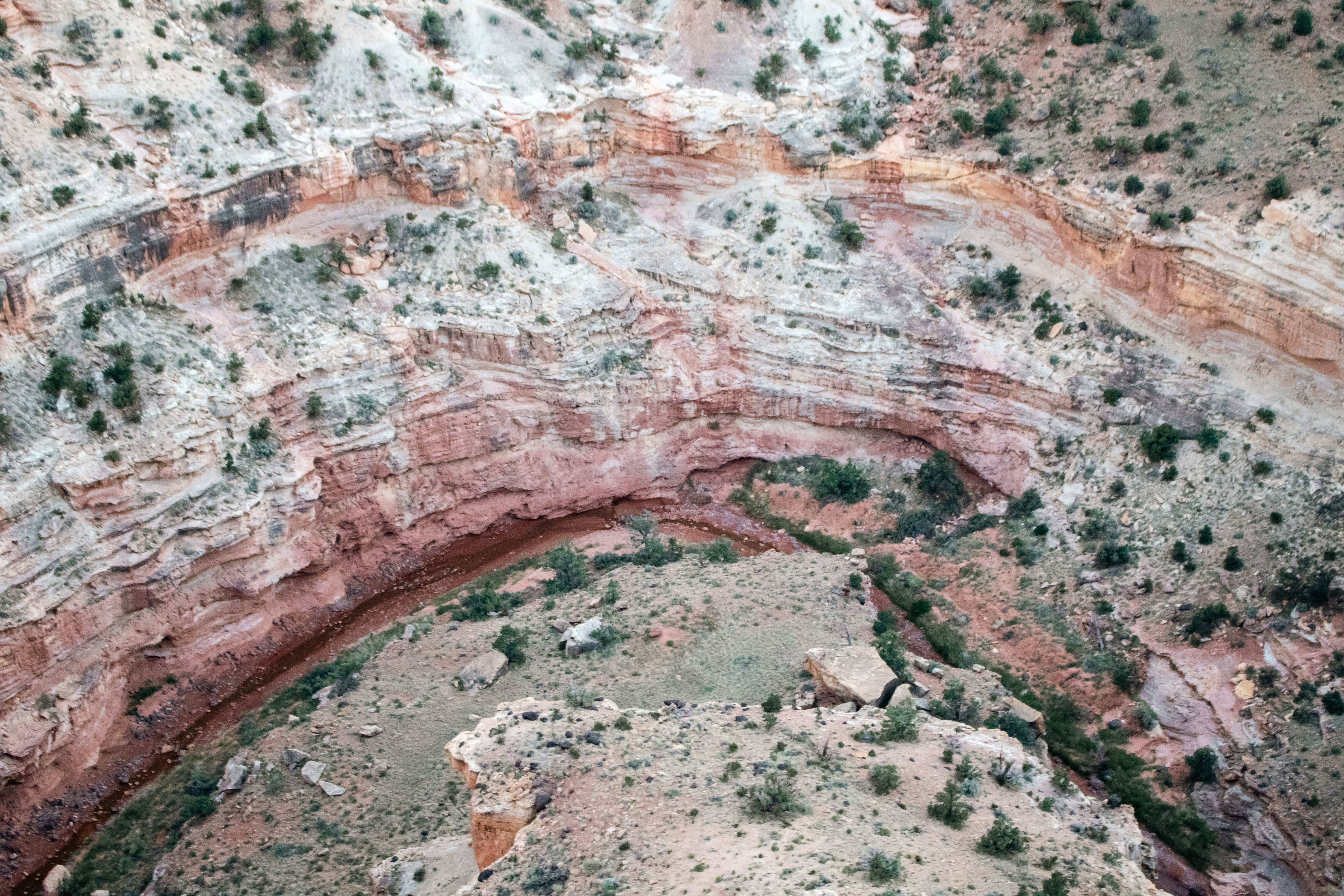 The Gooseneck in Capitol Reef National Park is a breathtaking overlook that reveals the meandering curve of Sulphur Creek, carved deep into the landscape by centuries of erosion. This geological feature offers panoramic views of the surrounding cliffs, mesas, and the winding canyon below. The overlook is accessible by a short hike, providing visitors with a stunning vantage point to appreciate Capitol Reef's unique topography and vibrant rock layers. The Gooseneck is a popular spot for photographers, hikers, and nature lovers seeking solitude and scenic beauty.