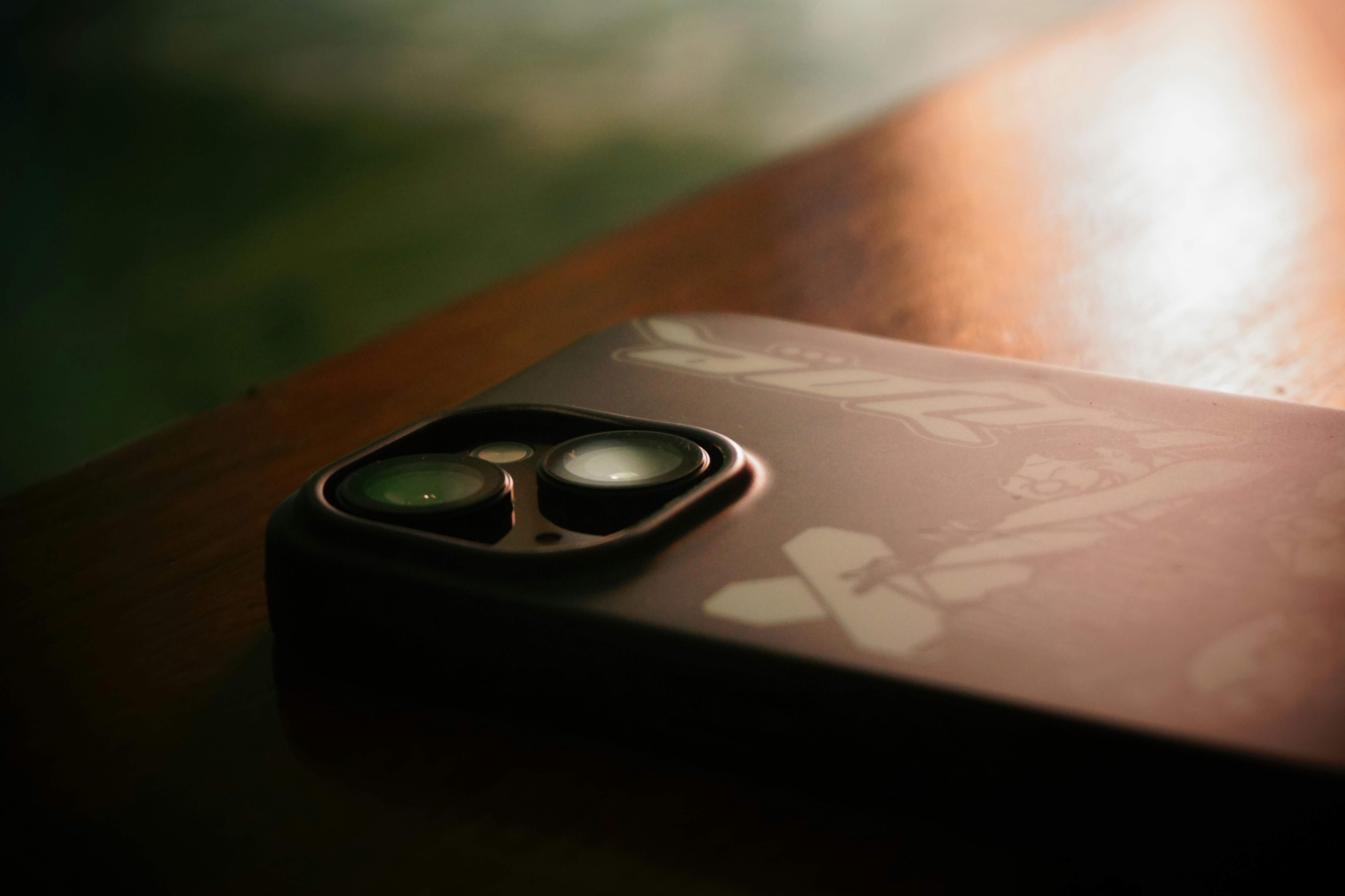 A close up of a cell phone on a table photo – Free Product photography ...