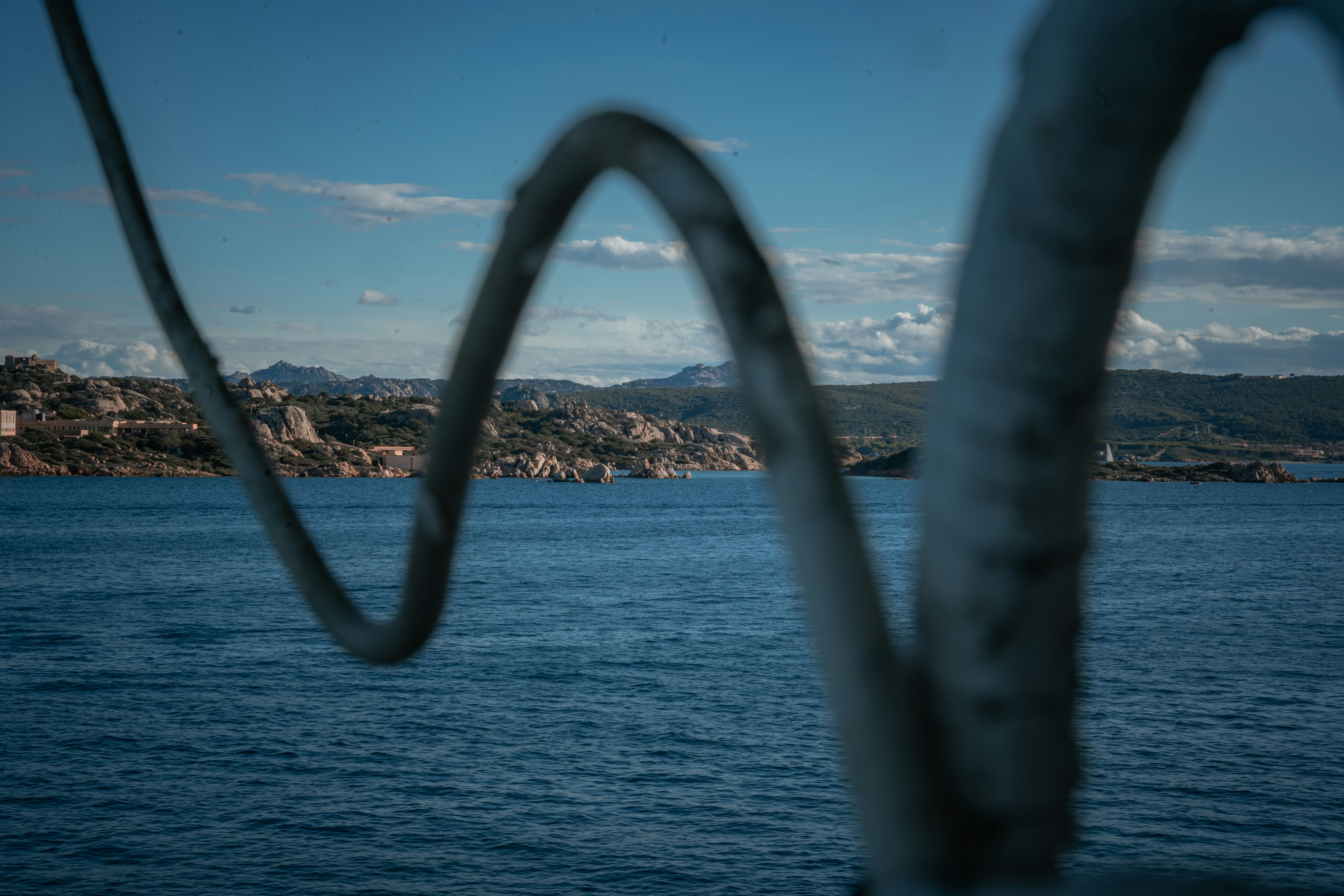 A view of a body of water with mountains in the background