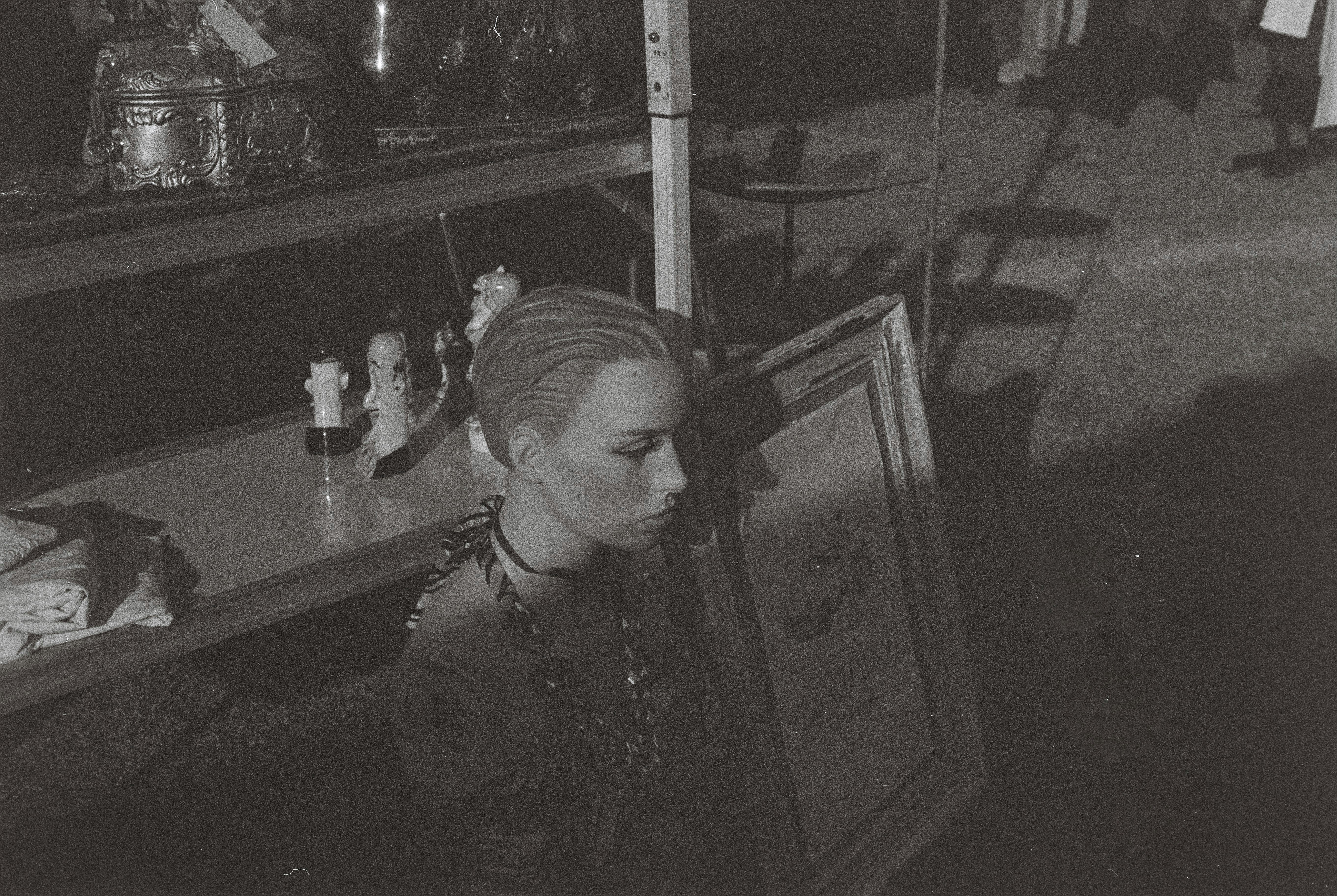 The Silent Muse in a Night Window: A Vintage Bust Framed by Candles