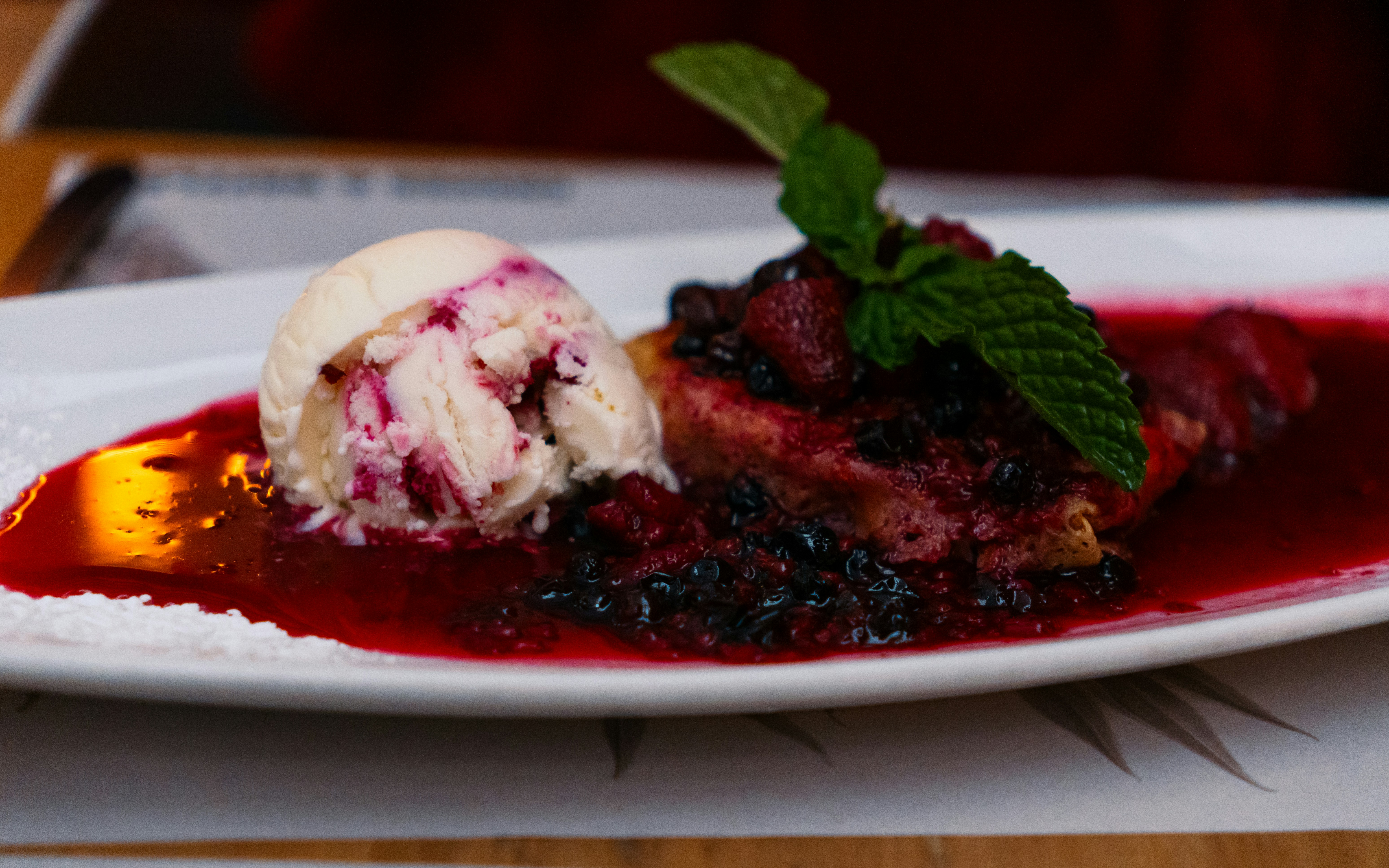 Berry Burst with Ice Cream on a Serrated Plate
