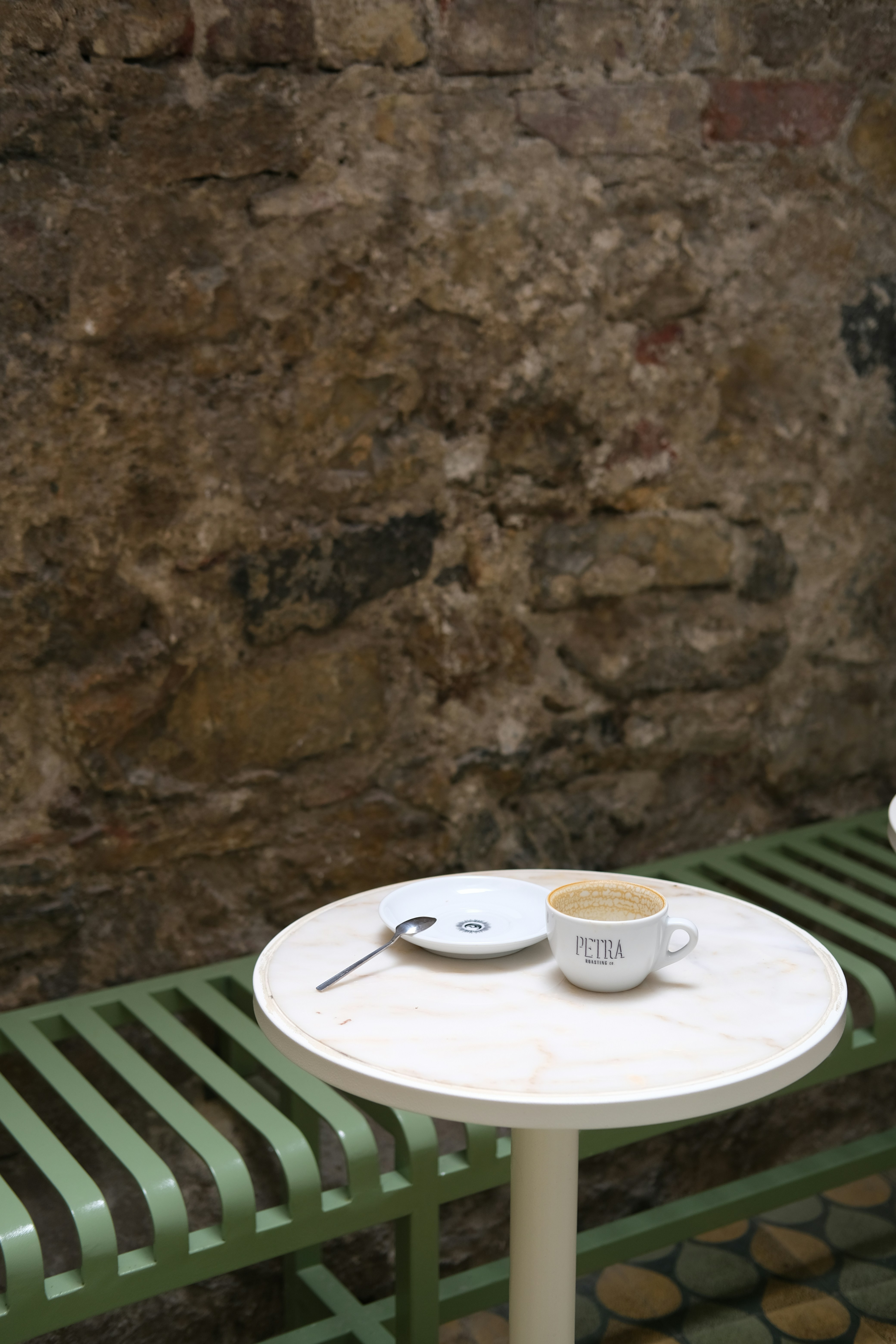 Two cups of coffee sit on a table next to a bench photo – Free Coffee ...