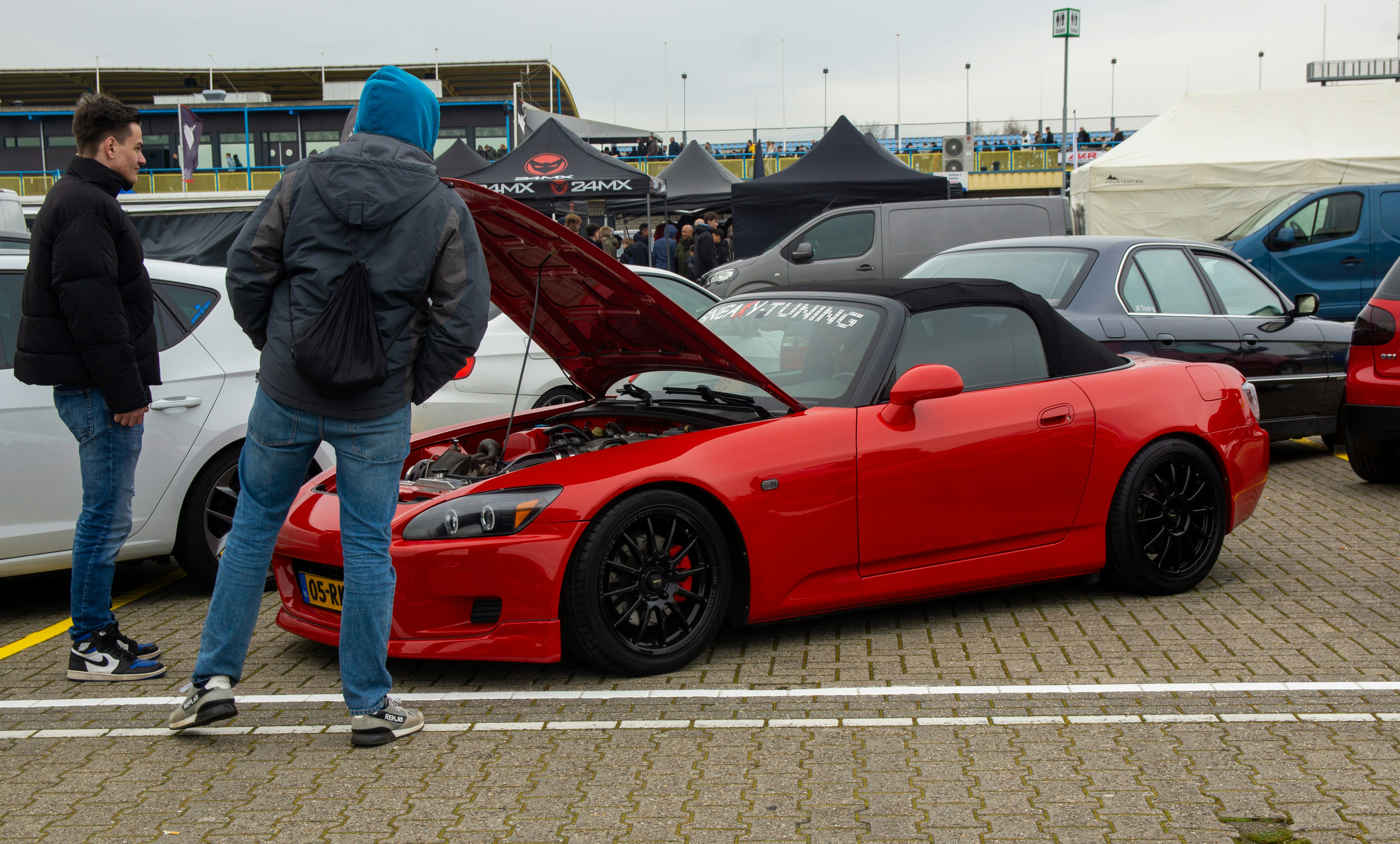Crimson Roadster Under the Hood at the Car Meet