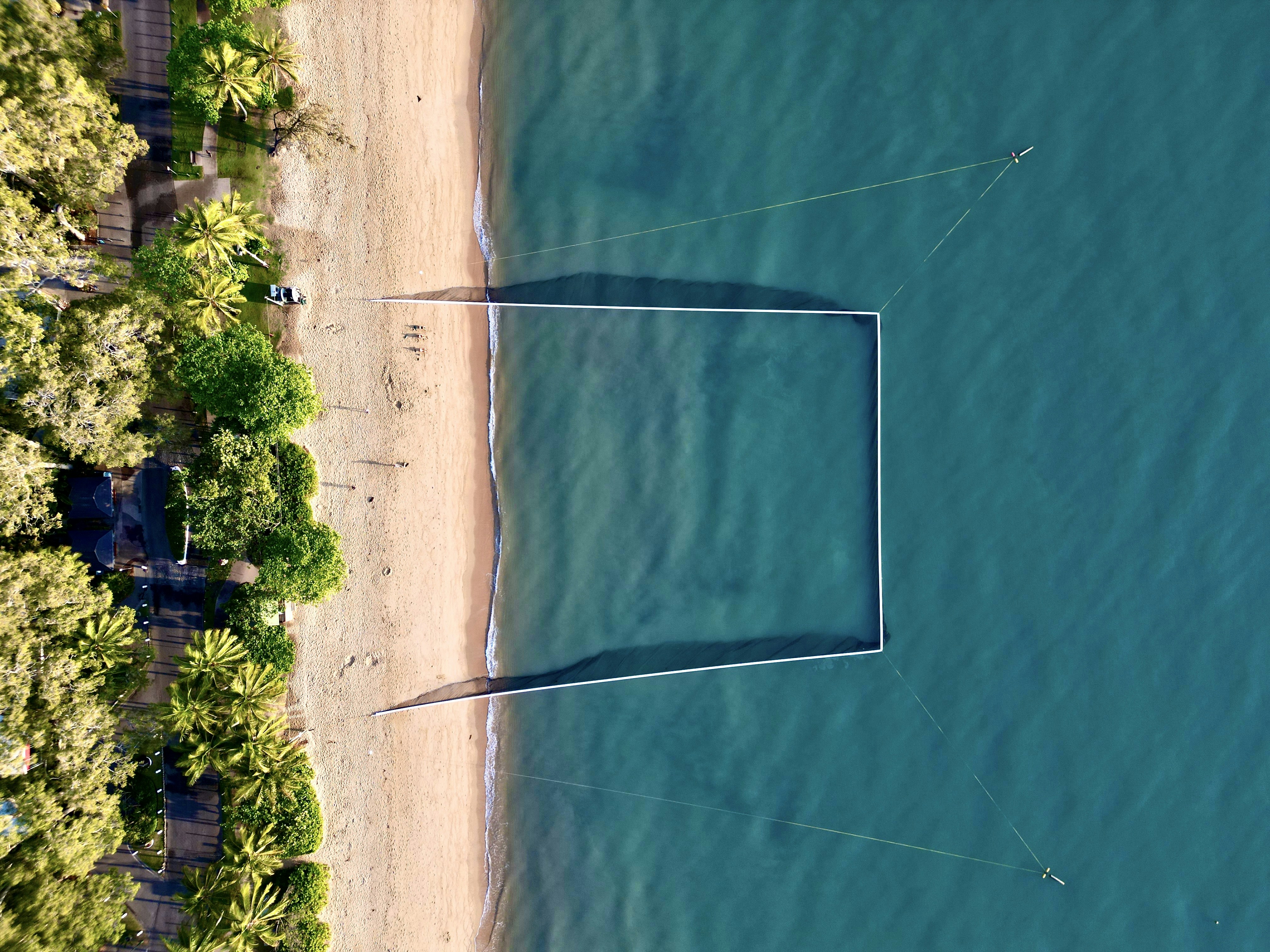 Rectangular Mirage Over Turquoise Shallows: An Aerial Beach Geometry