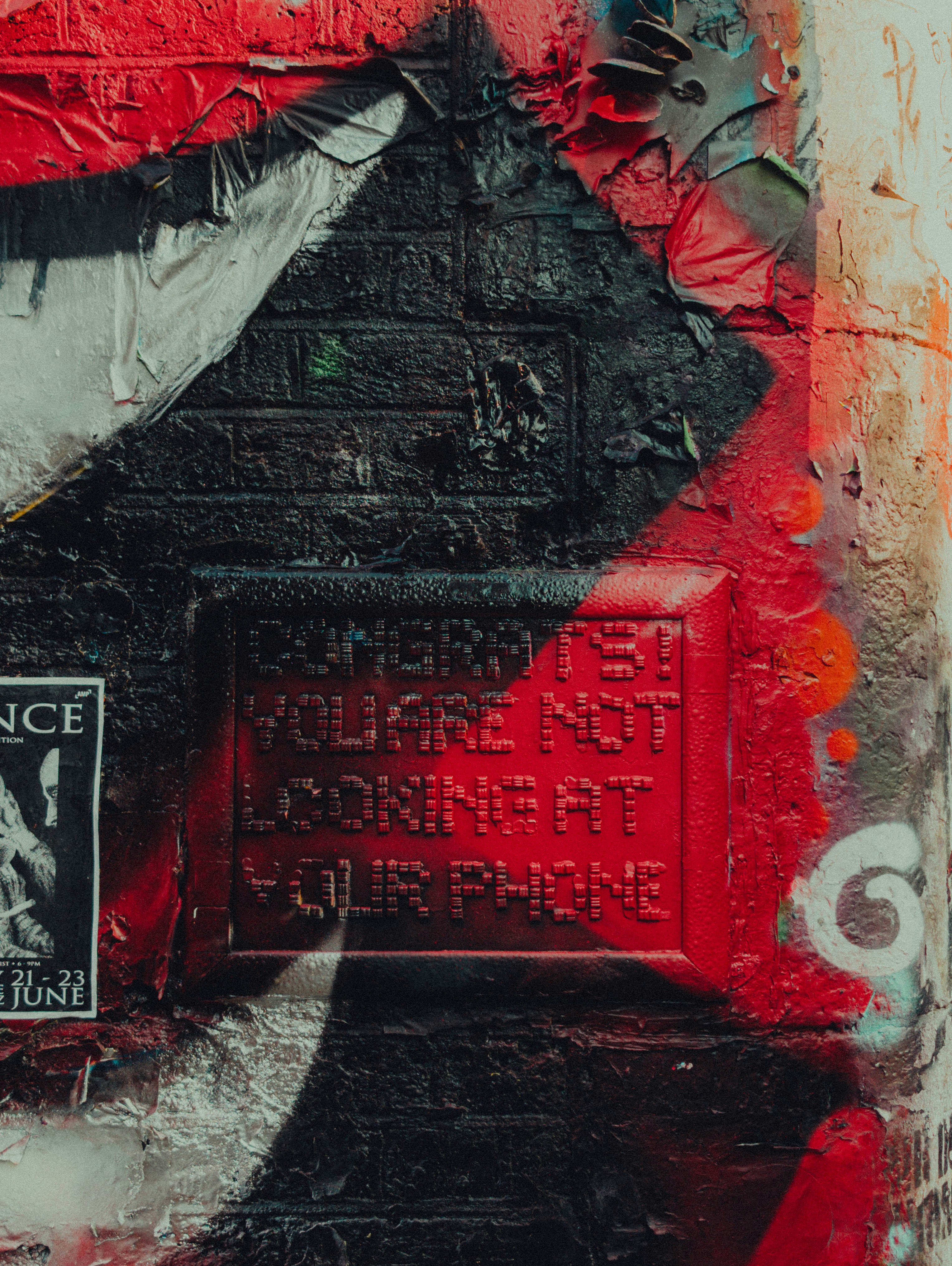 Red Urban Graffiti: Textured Wall, Door Message and Neon Hue