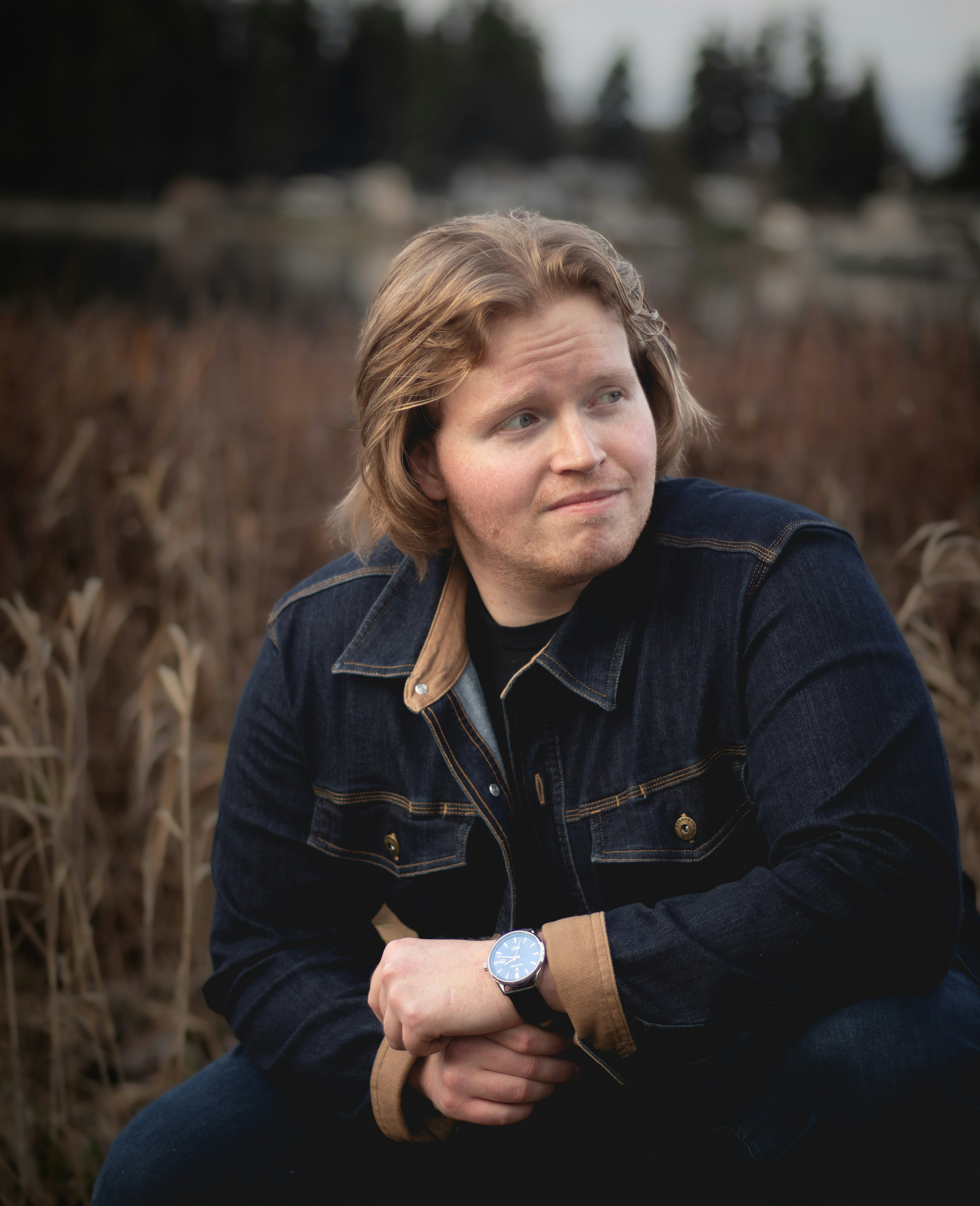 Denim and Dusk: A Quiet Portrait Among Autumn Reeds