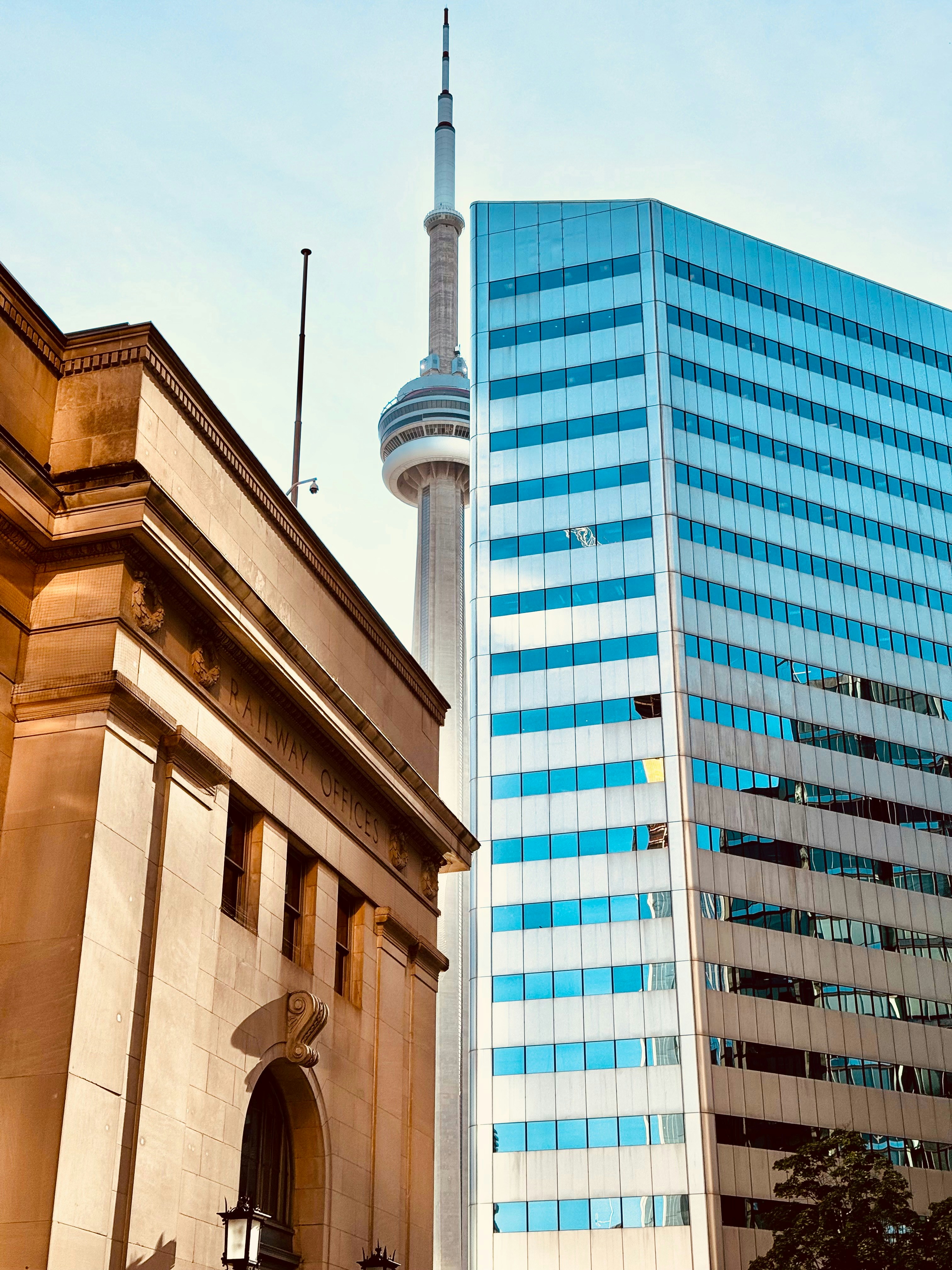 Stonework Meets Skyglass: The Toronto Skyline Framed by the CN Tower