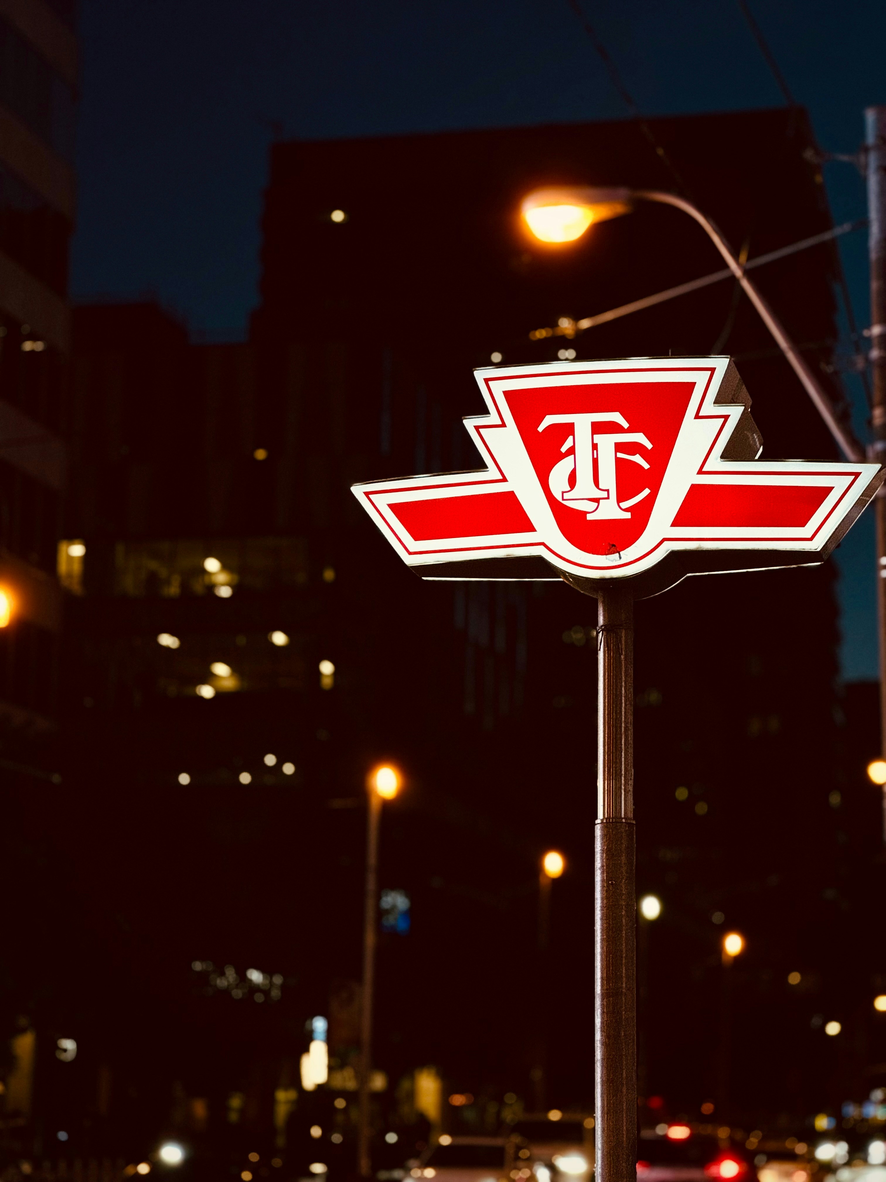 Crimson Crest on a Midnight City Street