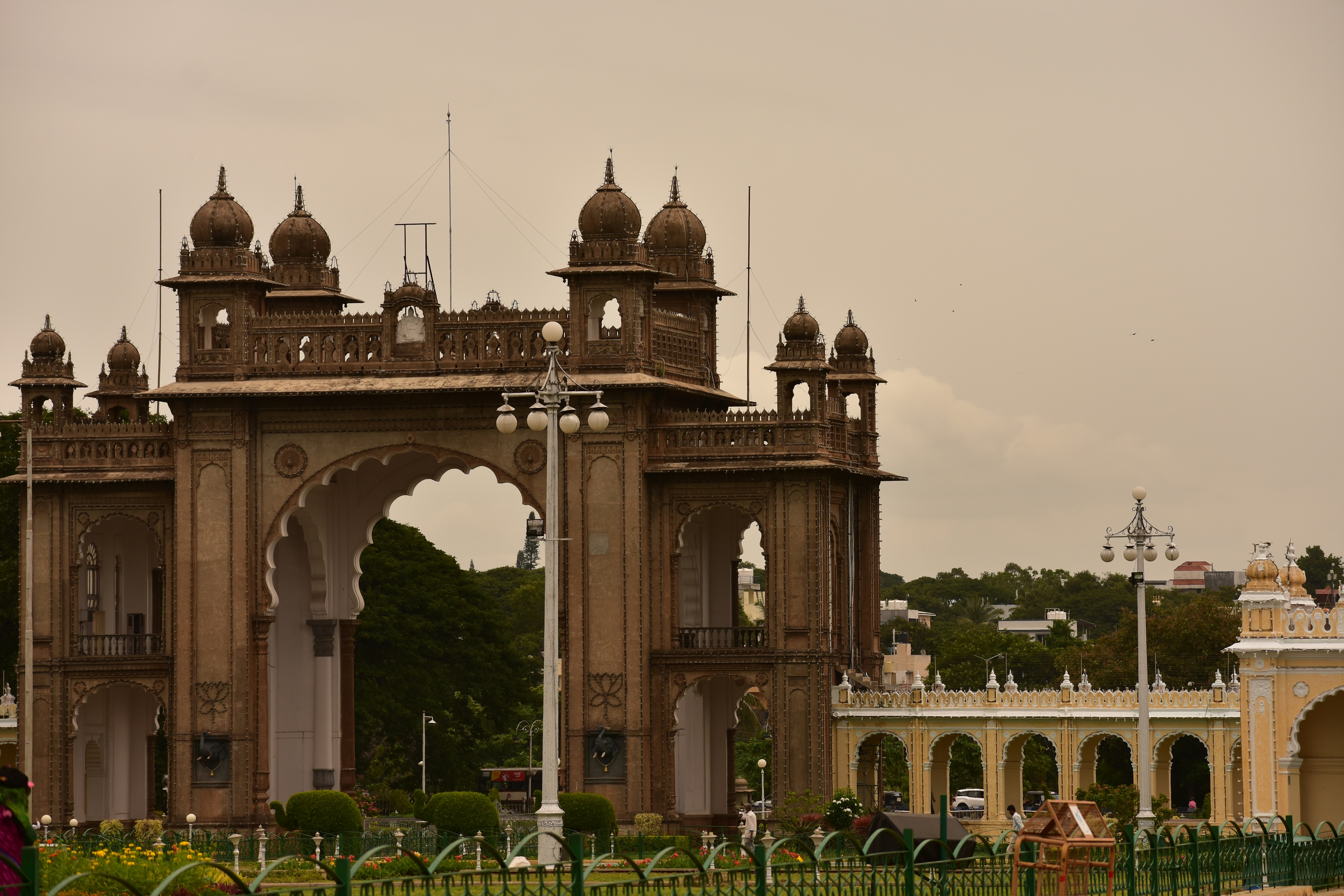 A group of people standing in front of a tall building photo – Free ...