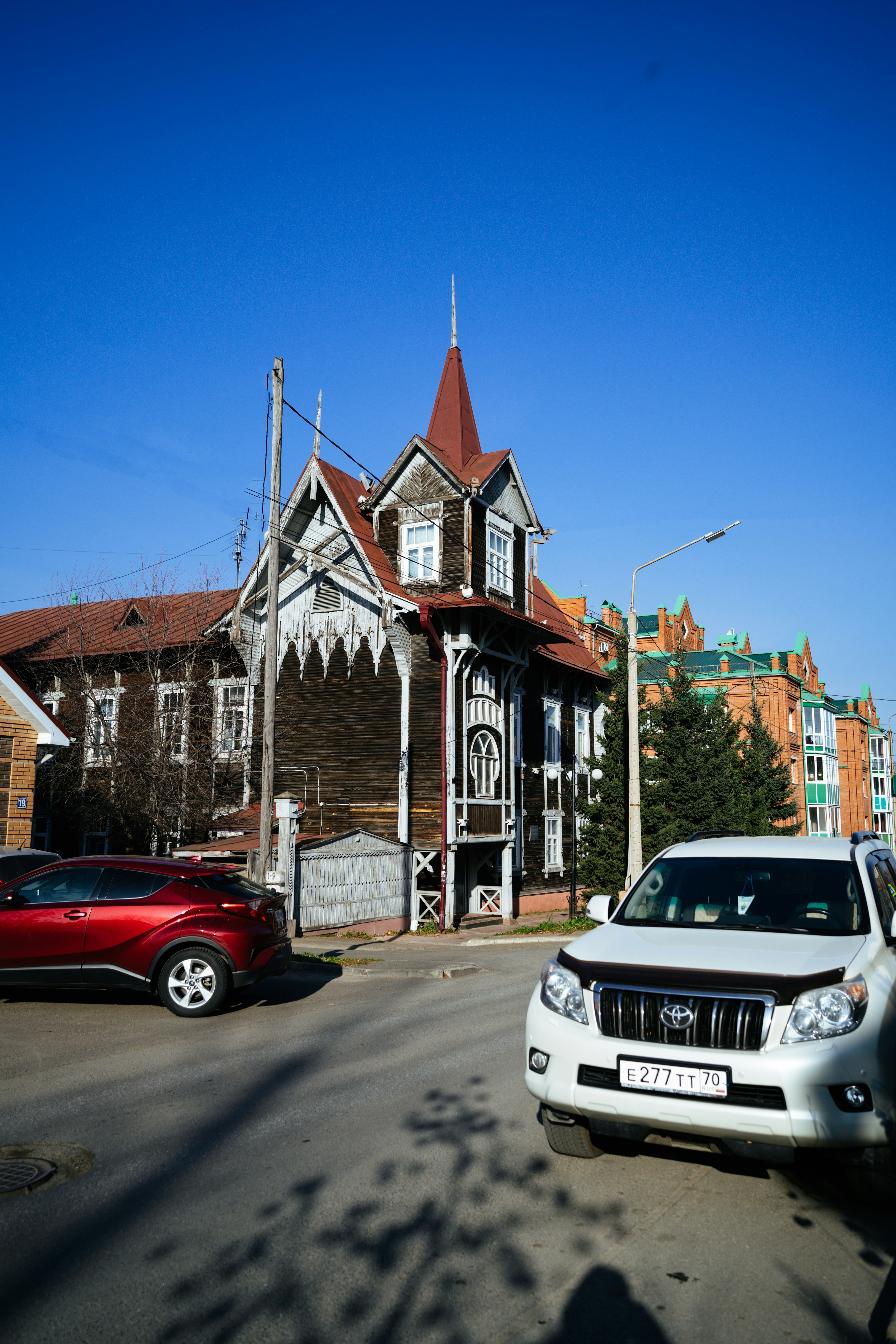 Ornate Timber Facade Framed by a Sunlit Street
