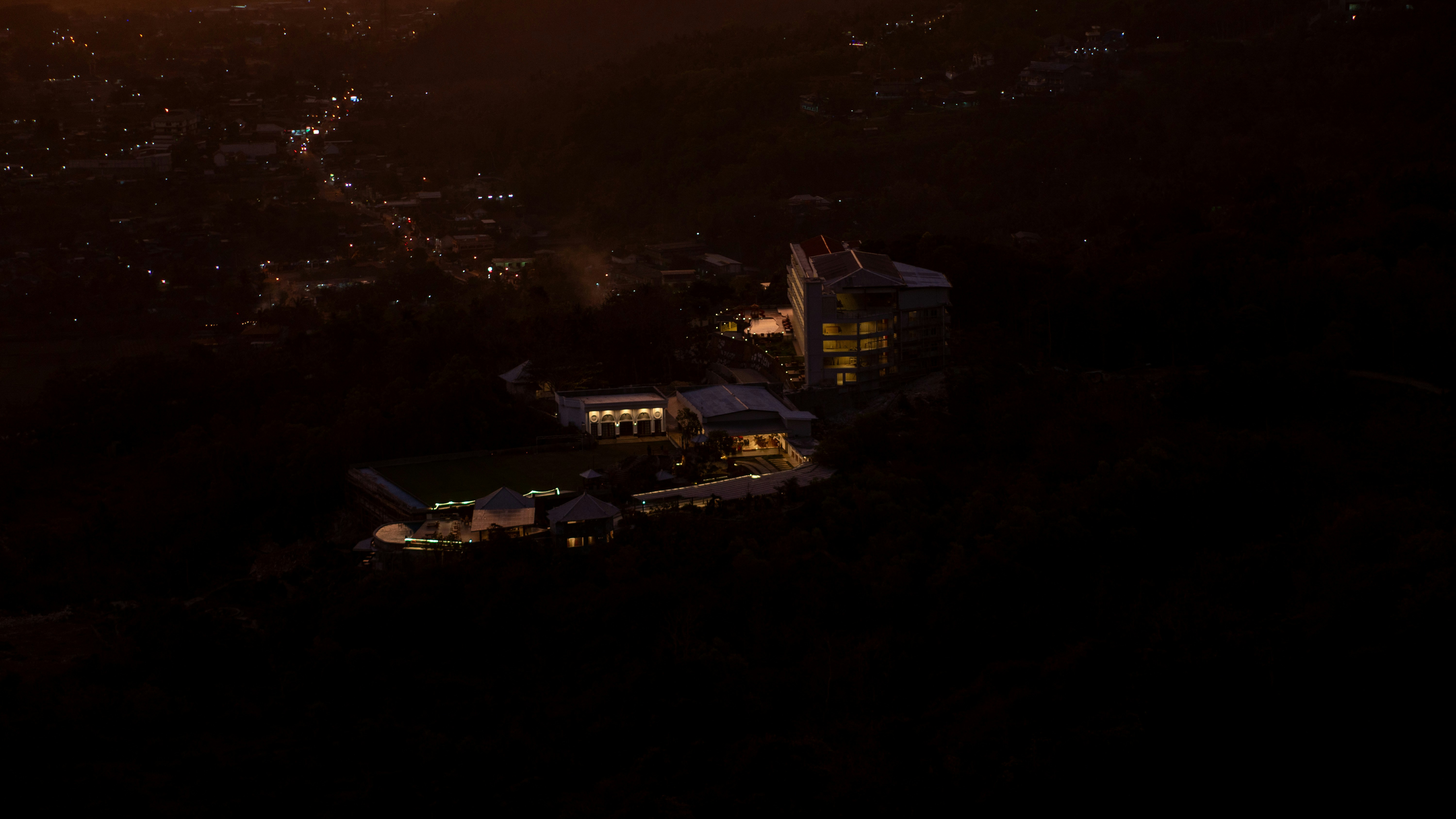Amber-lit Village Nestled on a Moonless Hillside