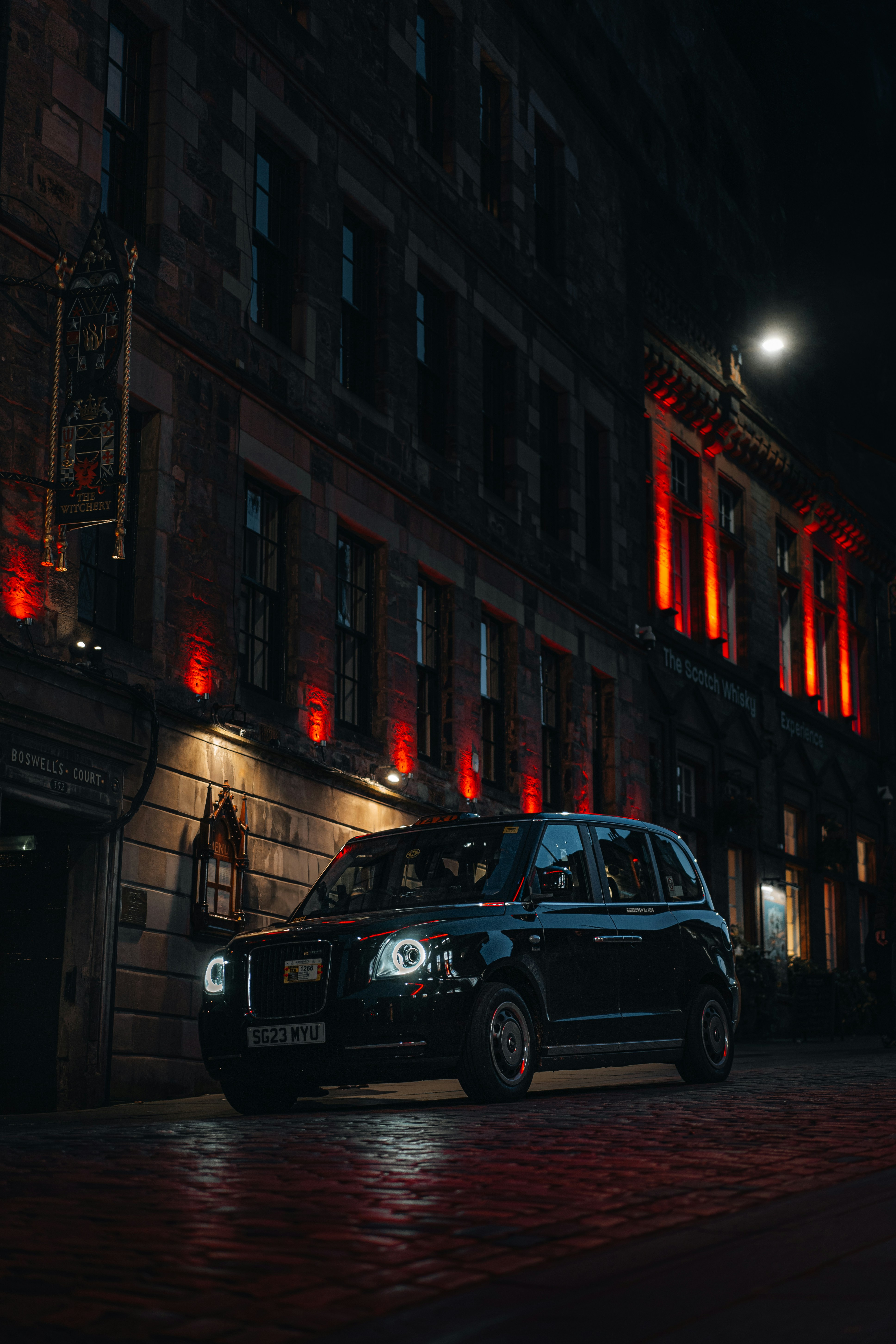 Crimson Facade, Black Cab: Night on Cobblestones