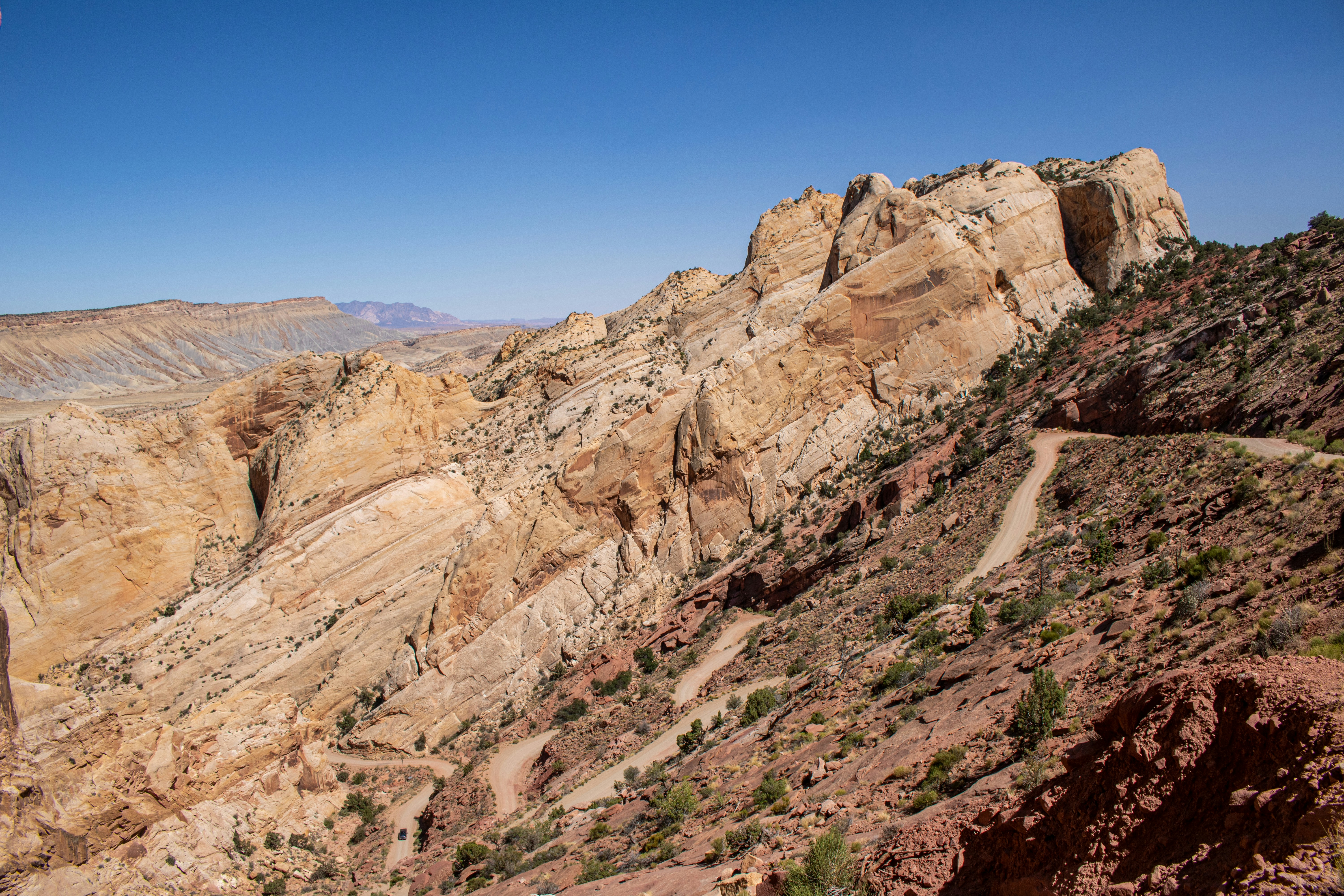 A dirt road in the middle of a mountain range photo – Free Burr trail ...