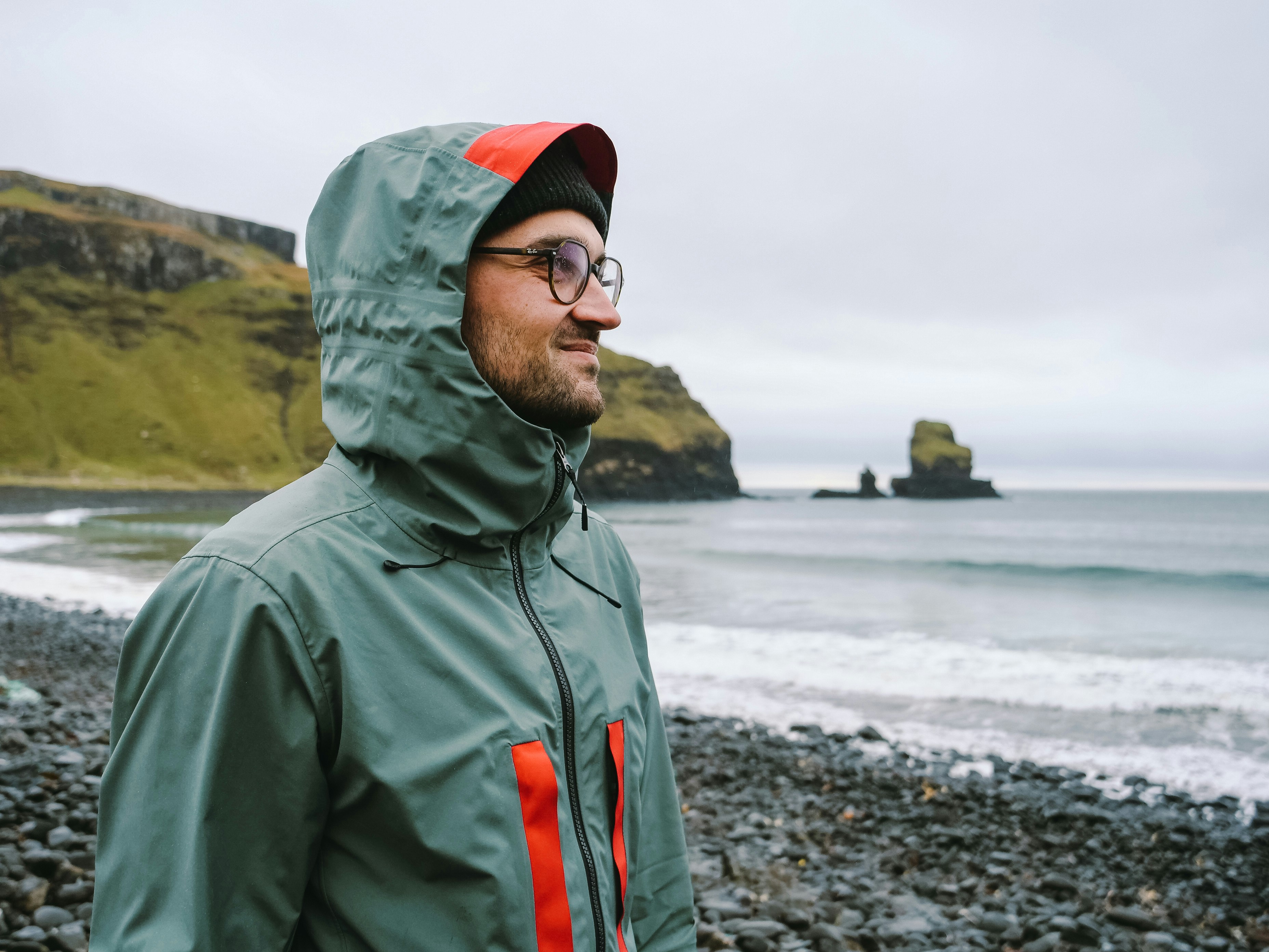 Windward Gaze: Portrait at a Rugged Coast with Sea Stack Backdrop