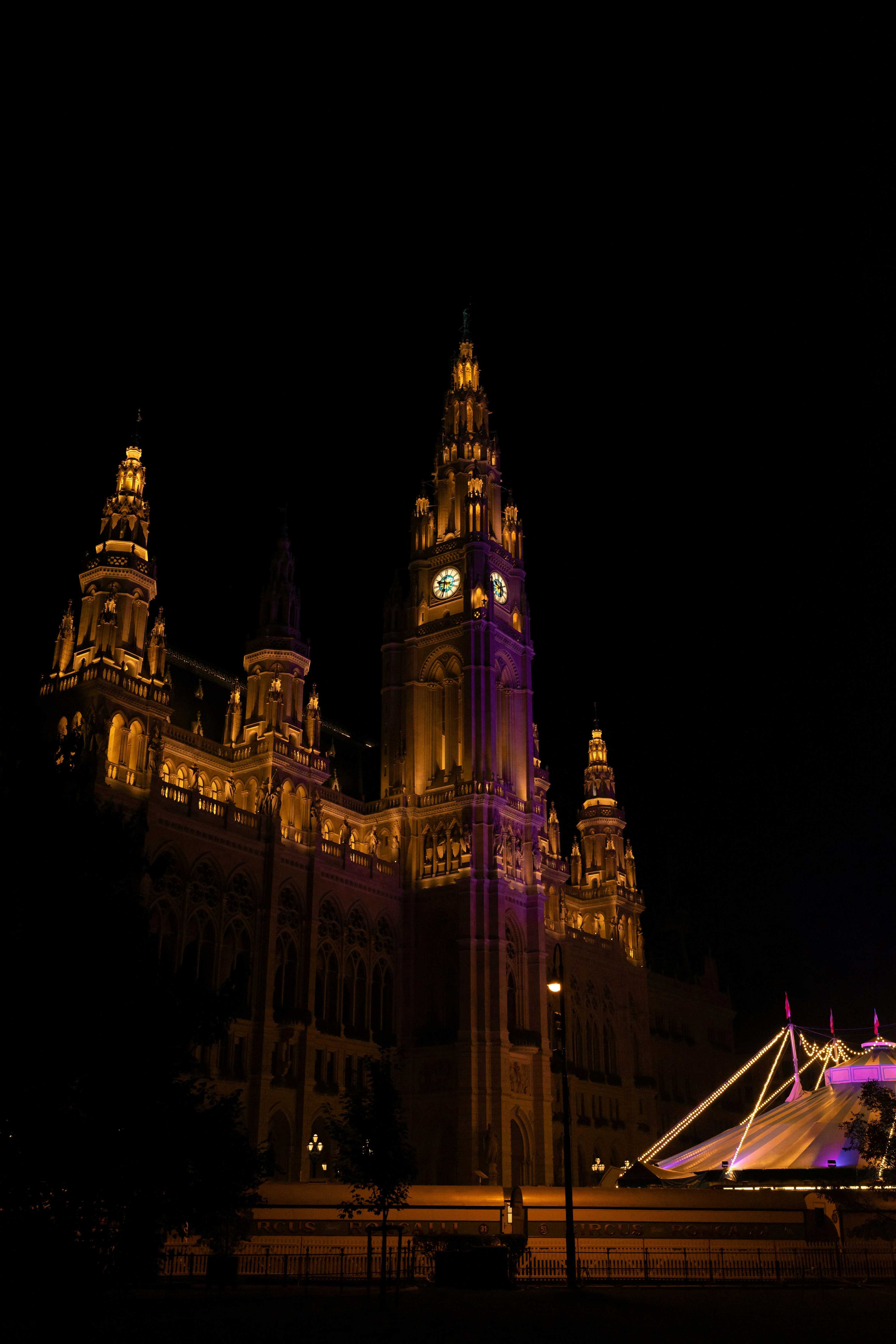 A large building lit up with lights at night photo – Free Vienna Image ...