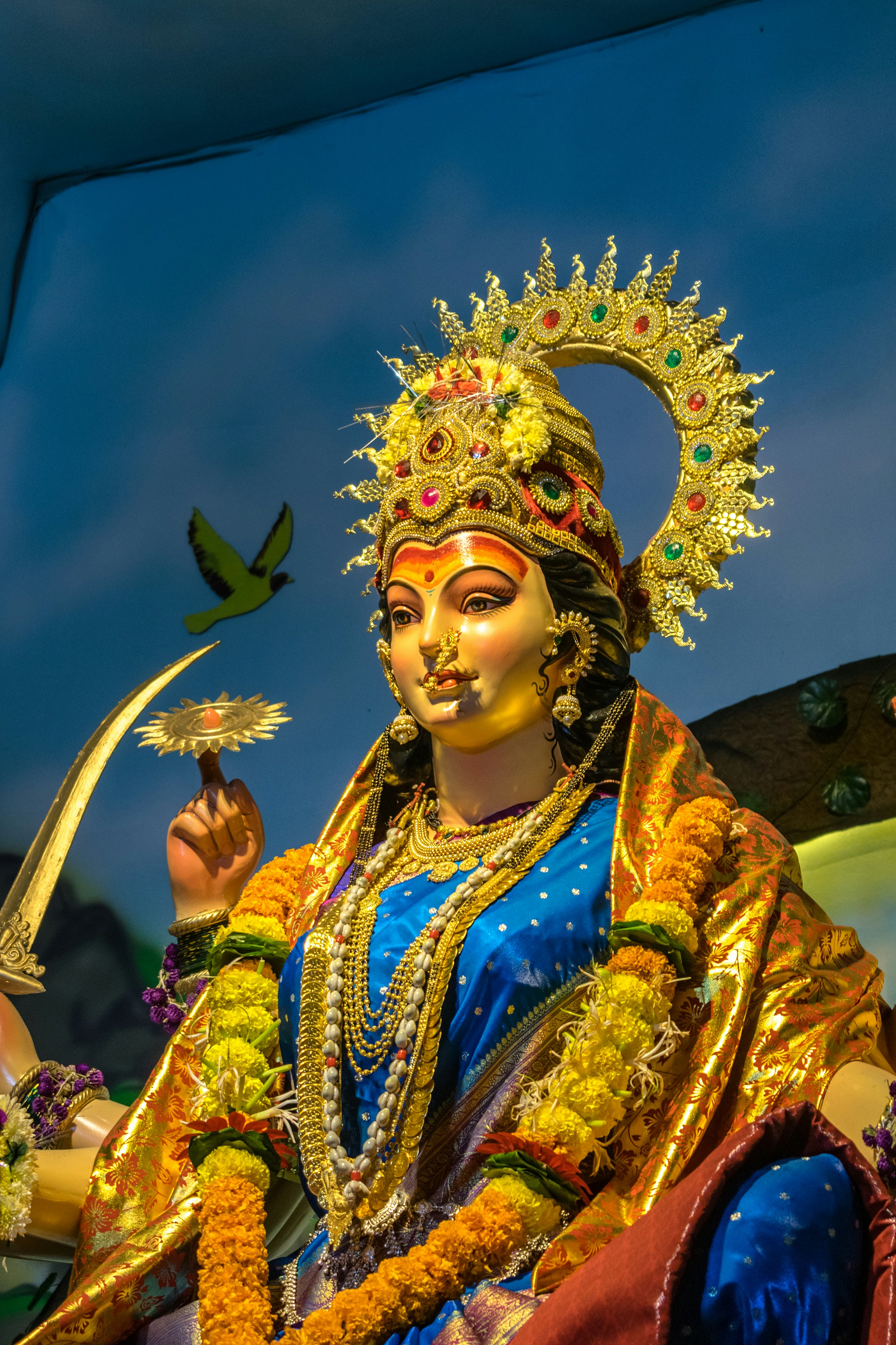 A statue of a woman with a bird in her hand photo – Free People Image ...