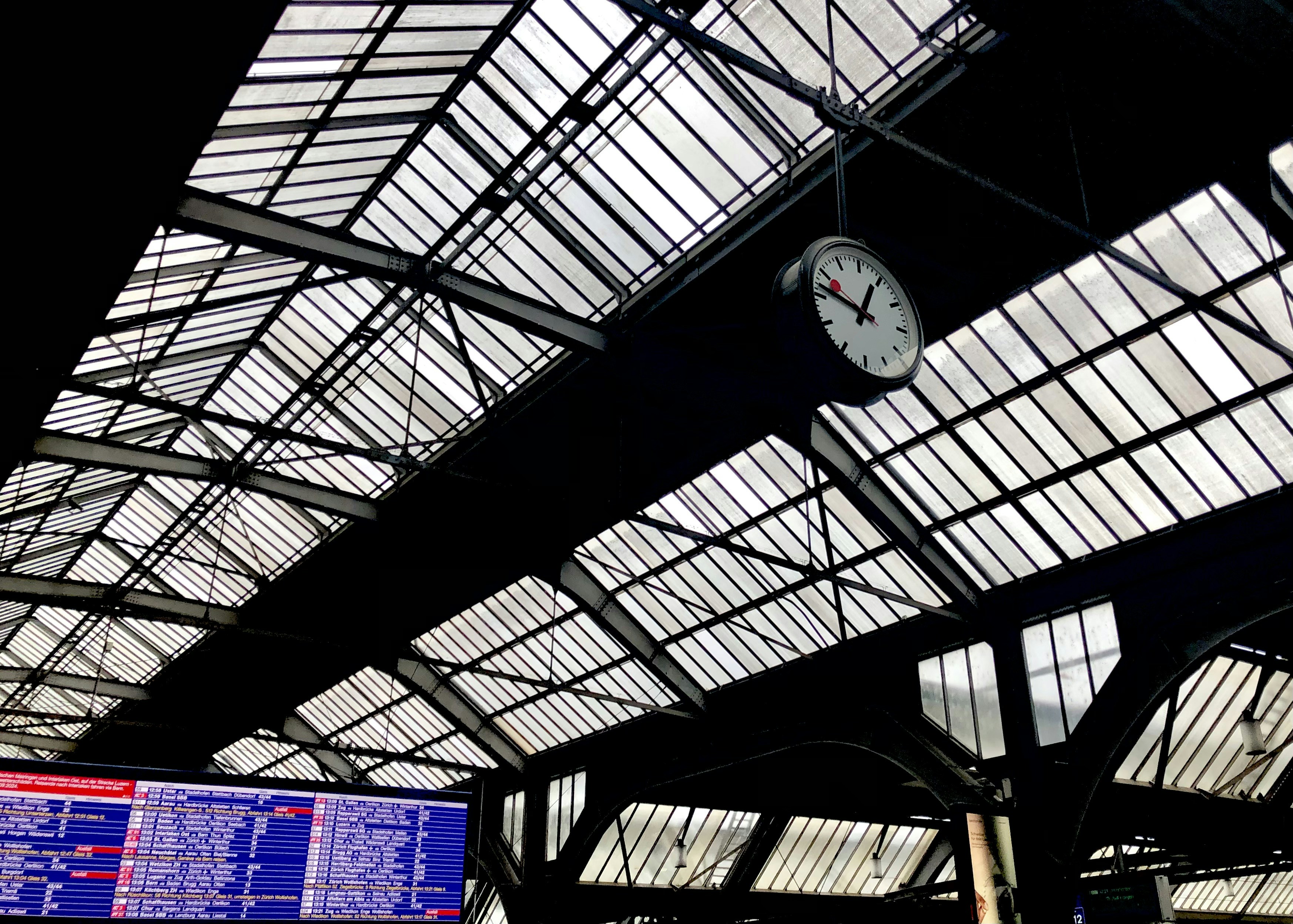 Clock Under the Glass Canopy: Time Framed by Steel and Light