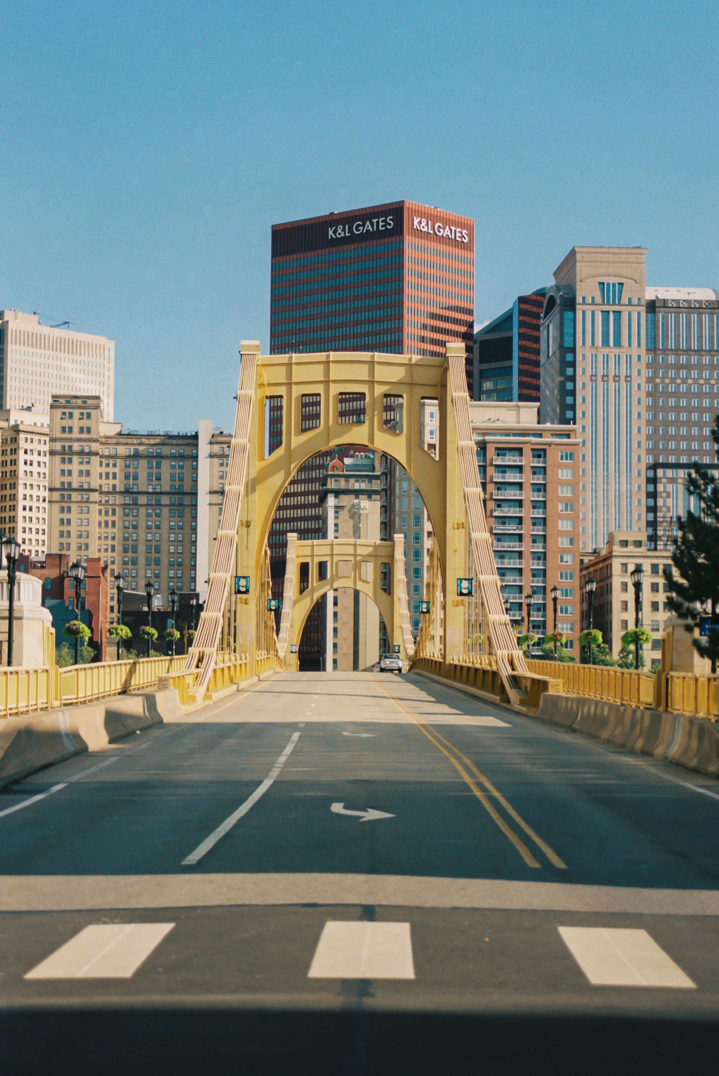 A city street with a bridge over it photo – Free Film photography Image ...