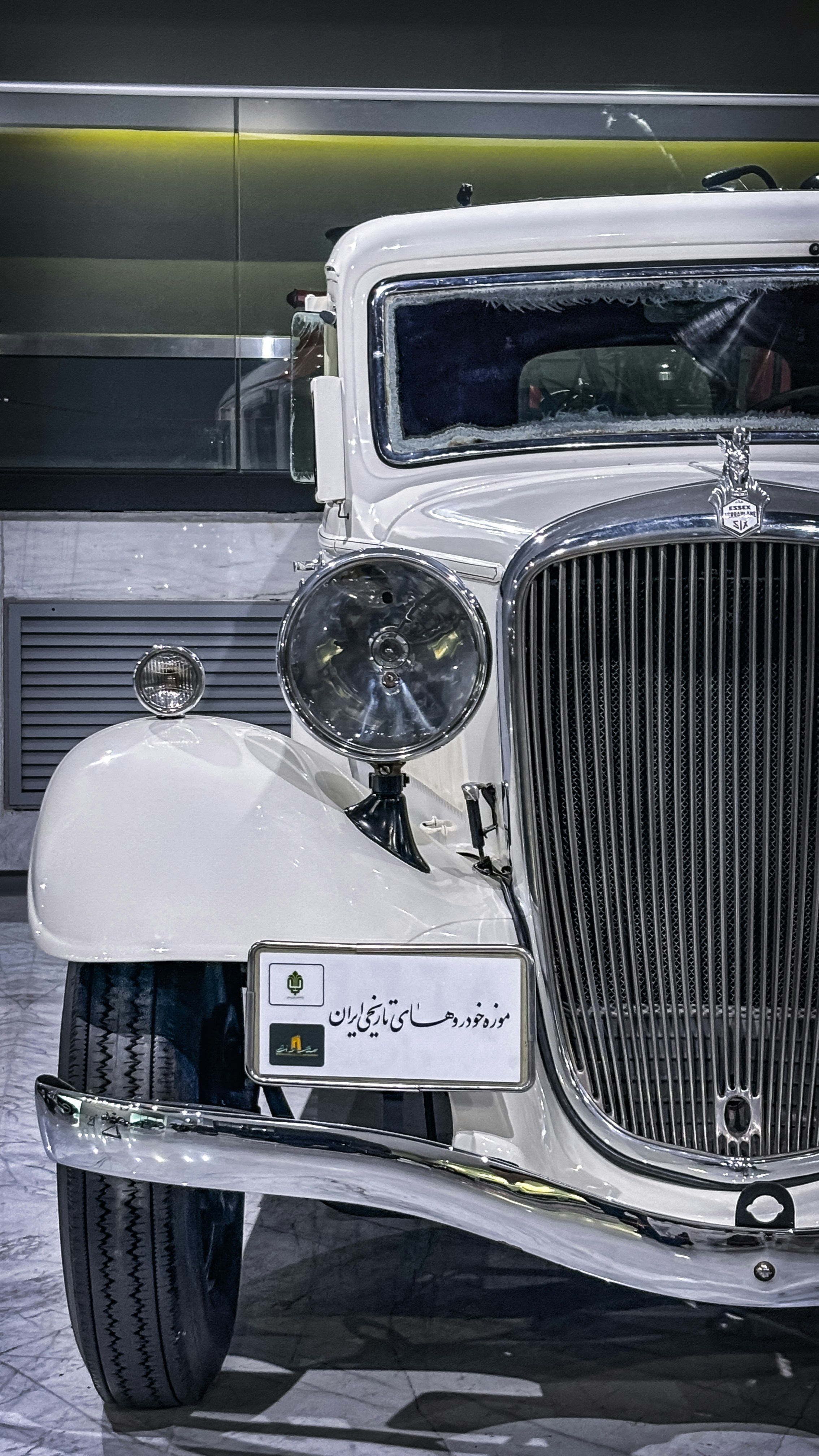 Chrome-Grille Classic: Front-View Portrait in Museum Lighting