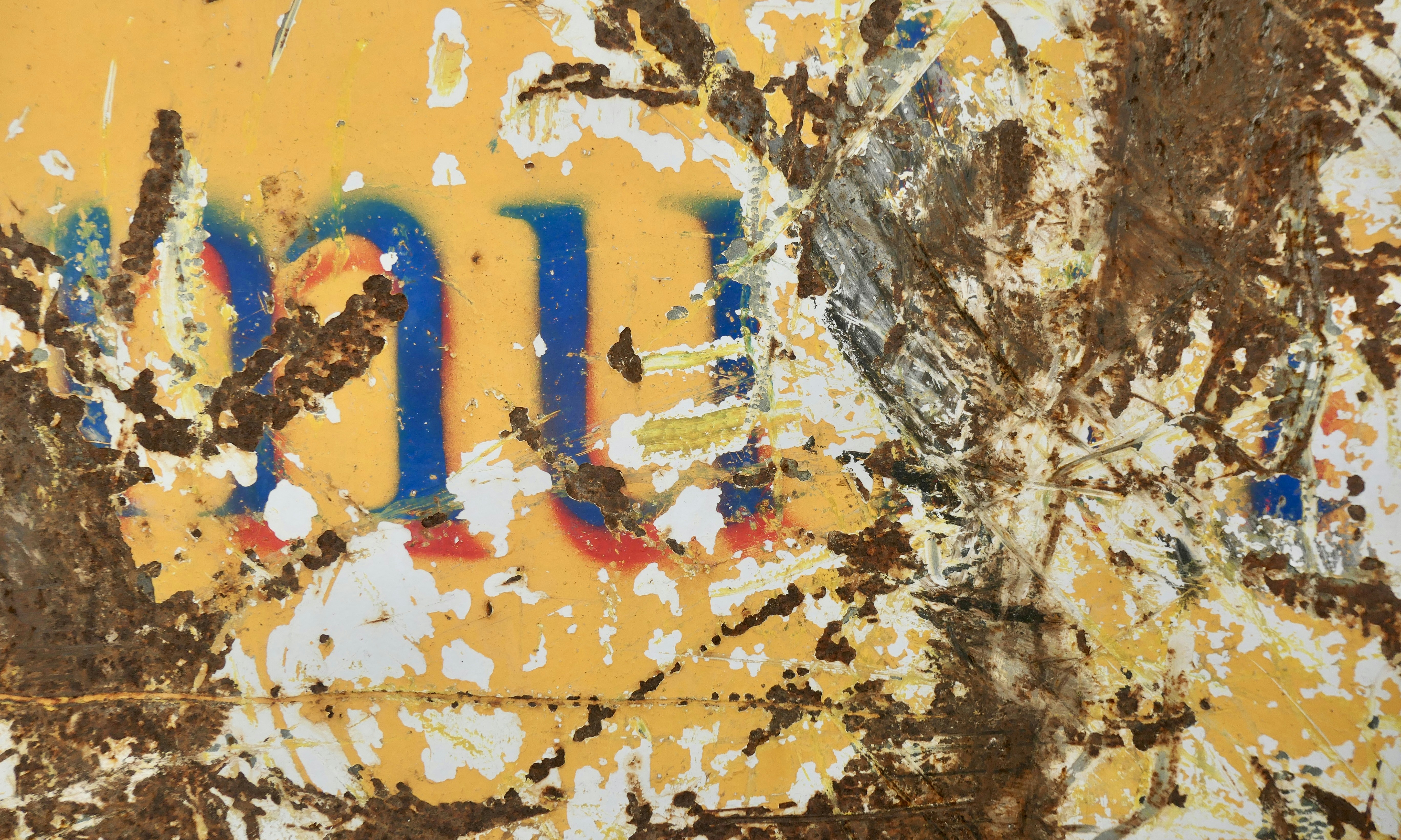 A close up of a yellow and blue sign on a wall photo – Free Text Image ...