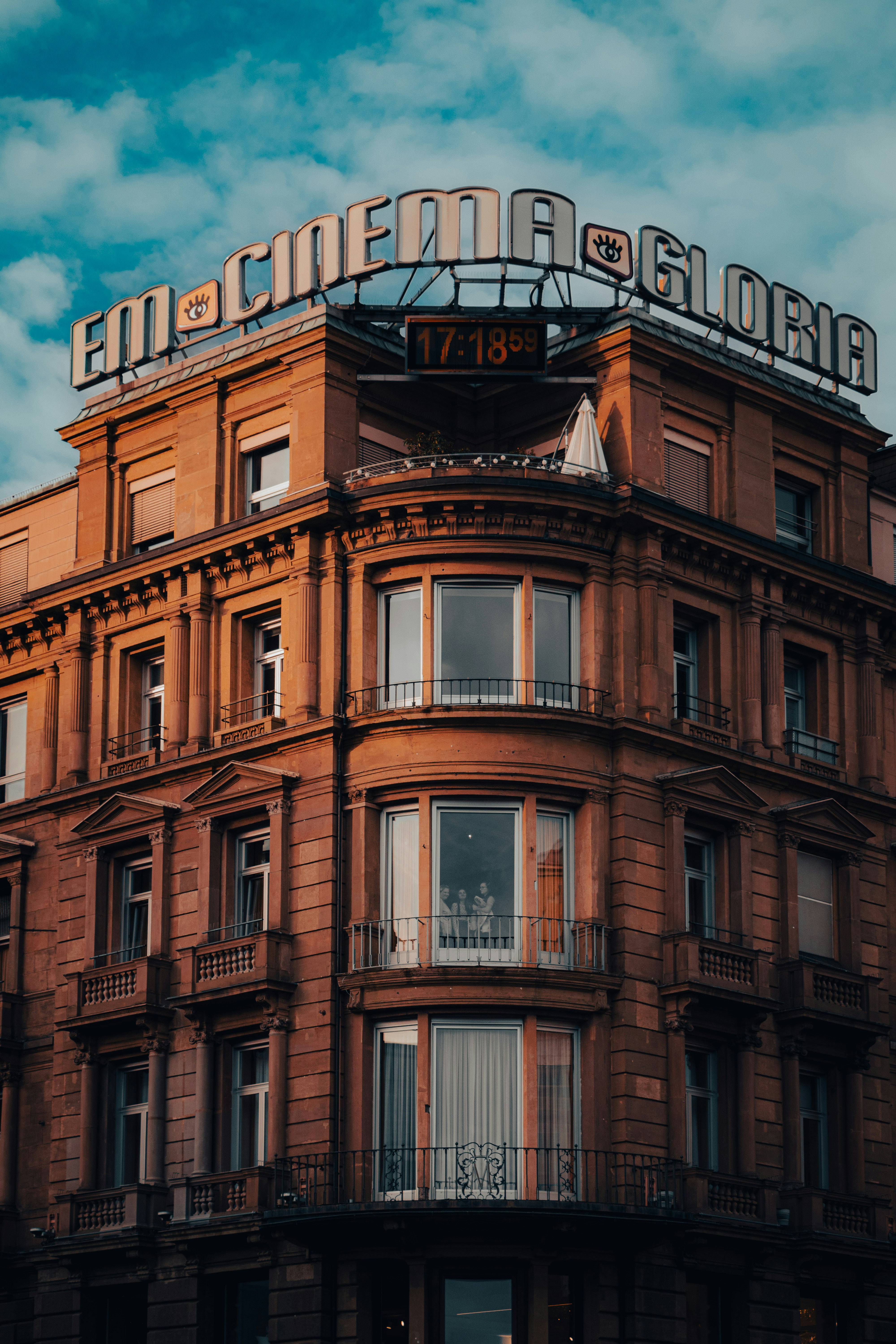 A tall building with a sign on top of it