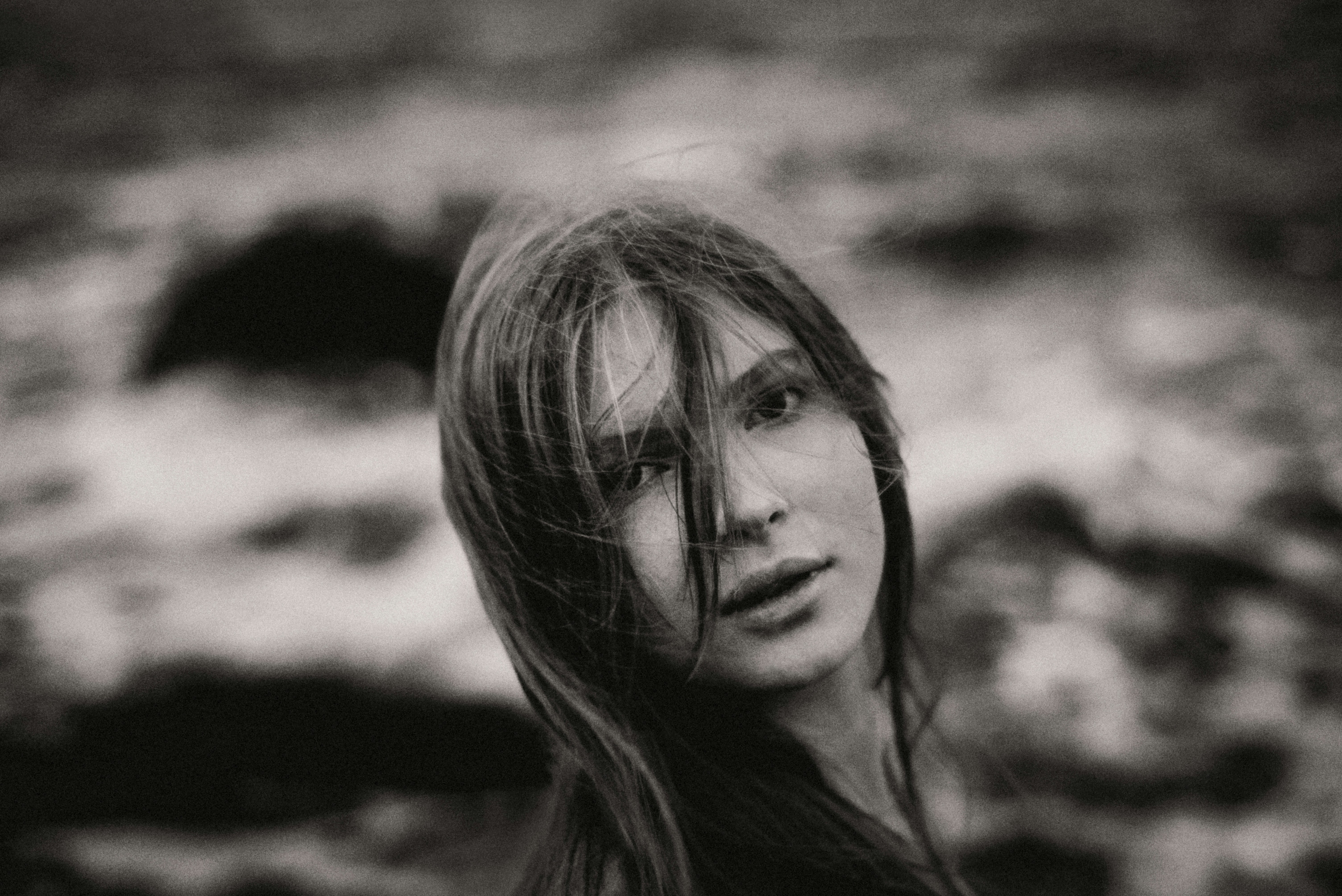 Wind-Tossed Intimacy: A Mono Portrait with Quiet Intensity