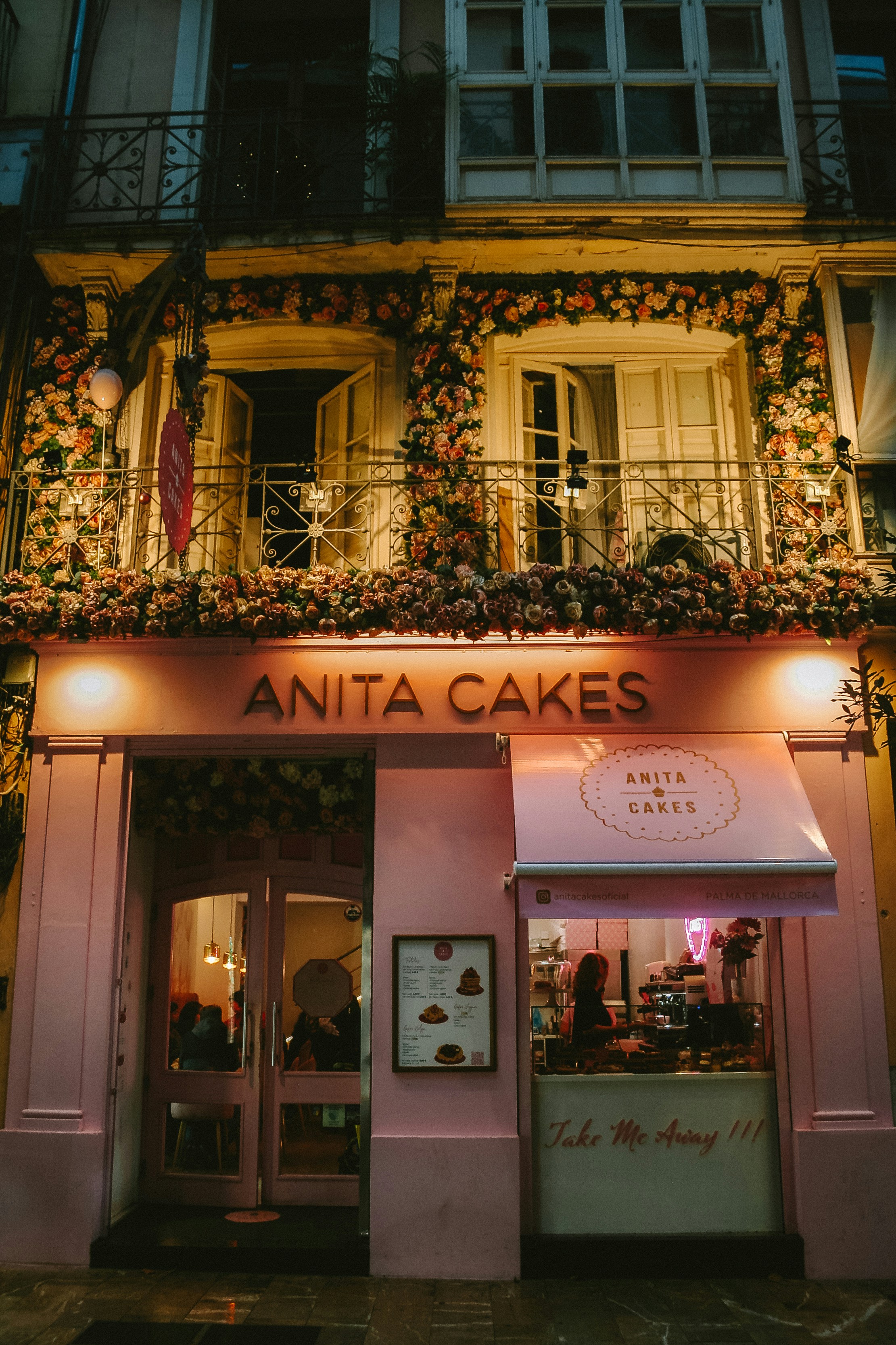 Night Bloom Over Anita Cakes: A Floral Facade Bakery