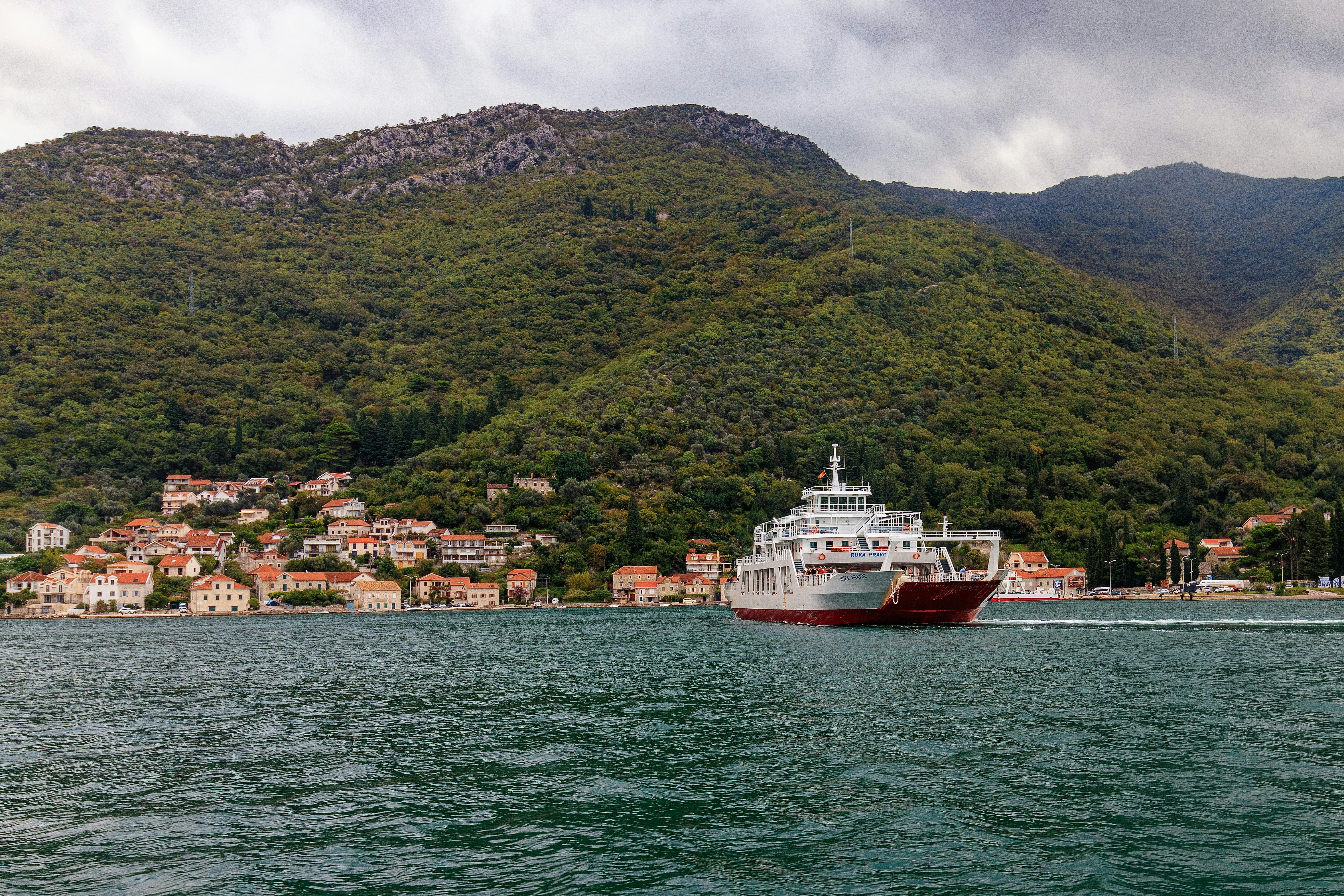 Ferry Crossing the Dalmatian Coast: White Vessel Against Pine-Clad Hills