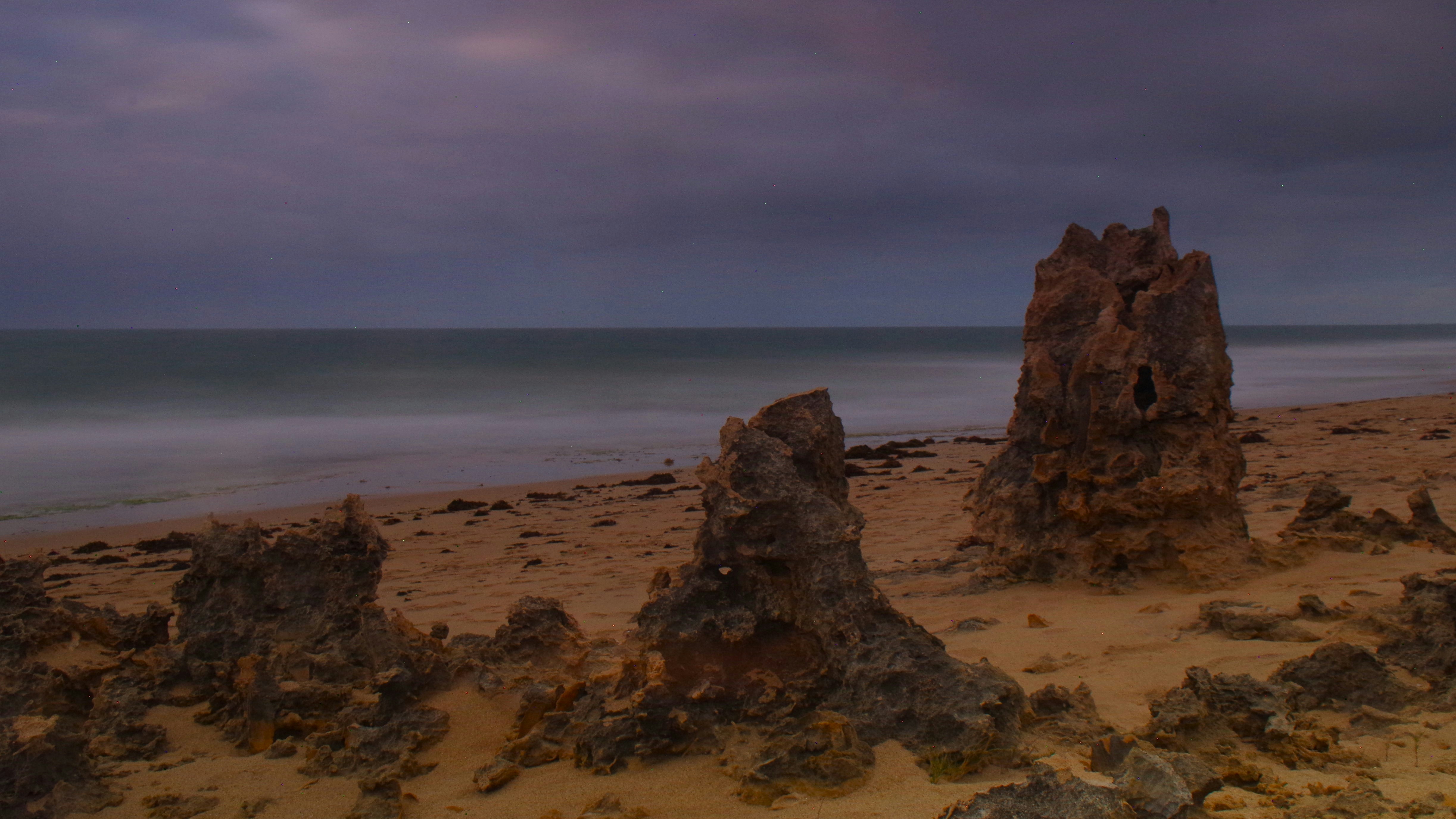 Long exposure image of limestone formations on the beach at Mandurah western Australia