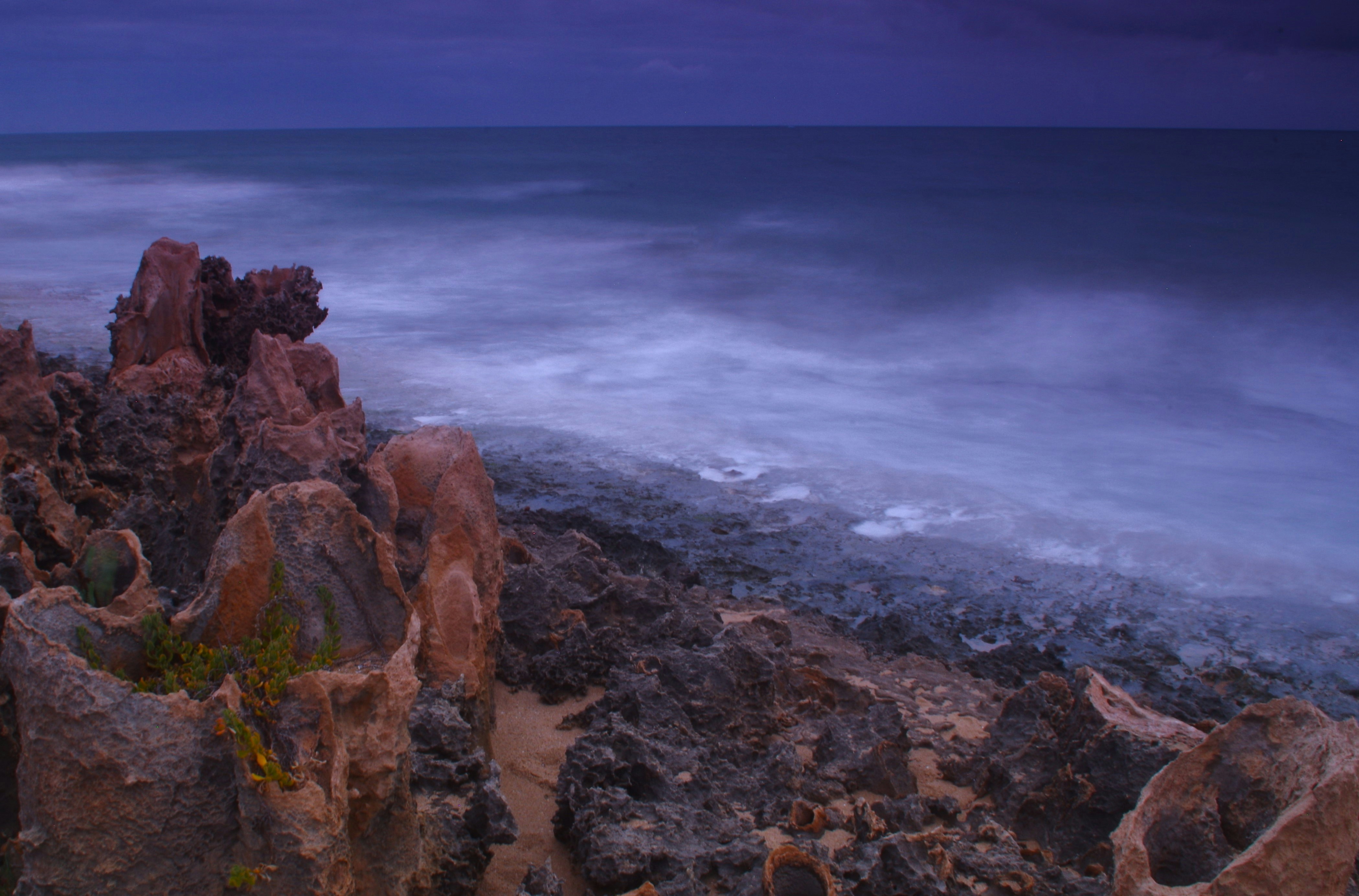 Blue Hour Silence: Velvet Tide and Jagged Coast