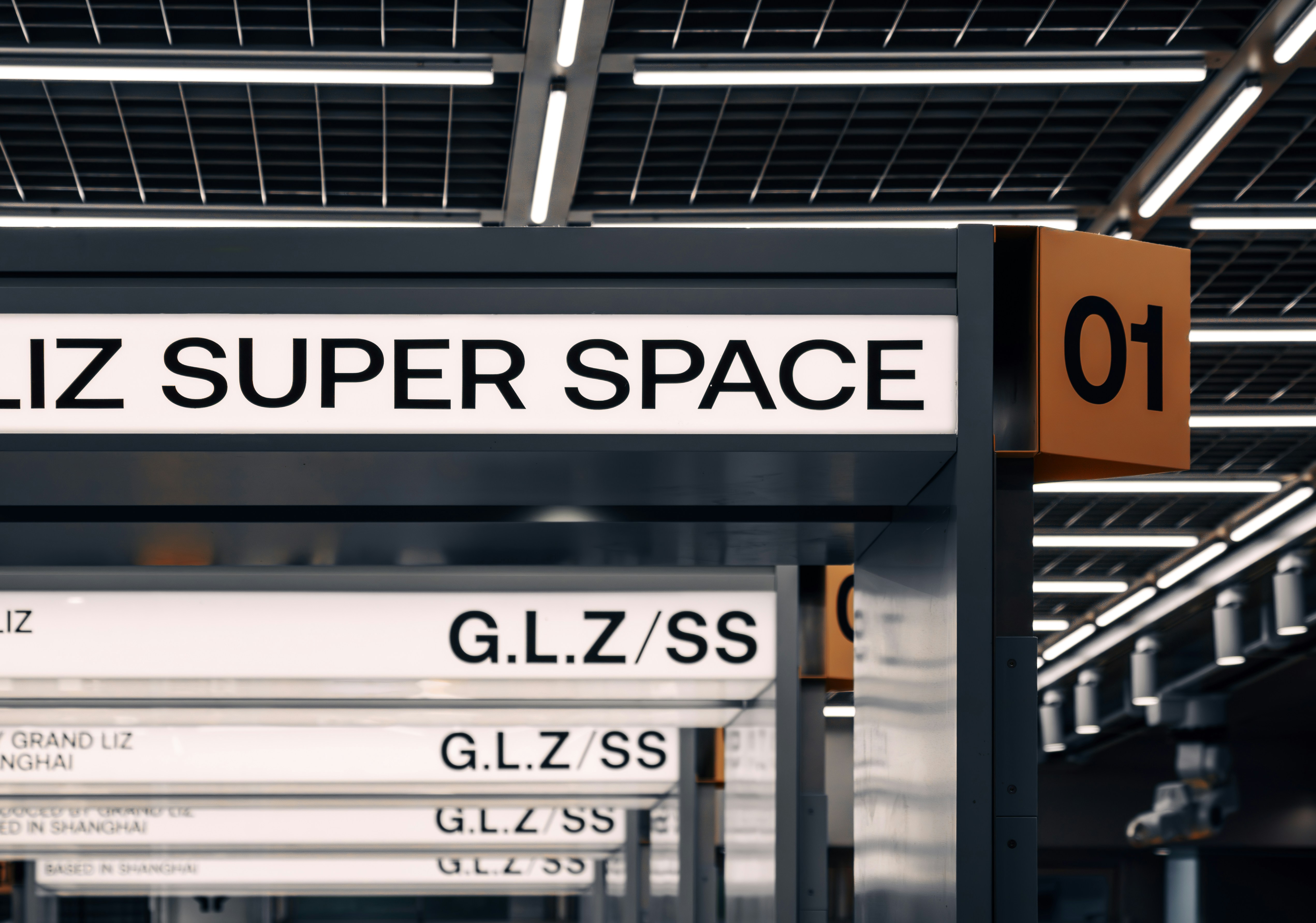 A subway station with a bunch of signs hanging from the ceiling photo ...