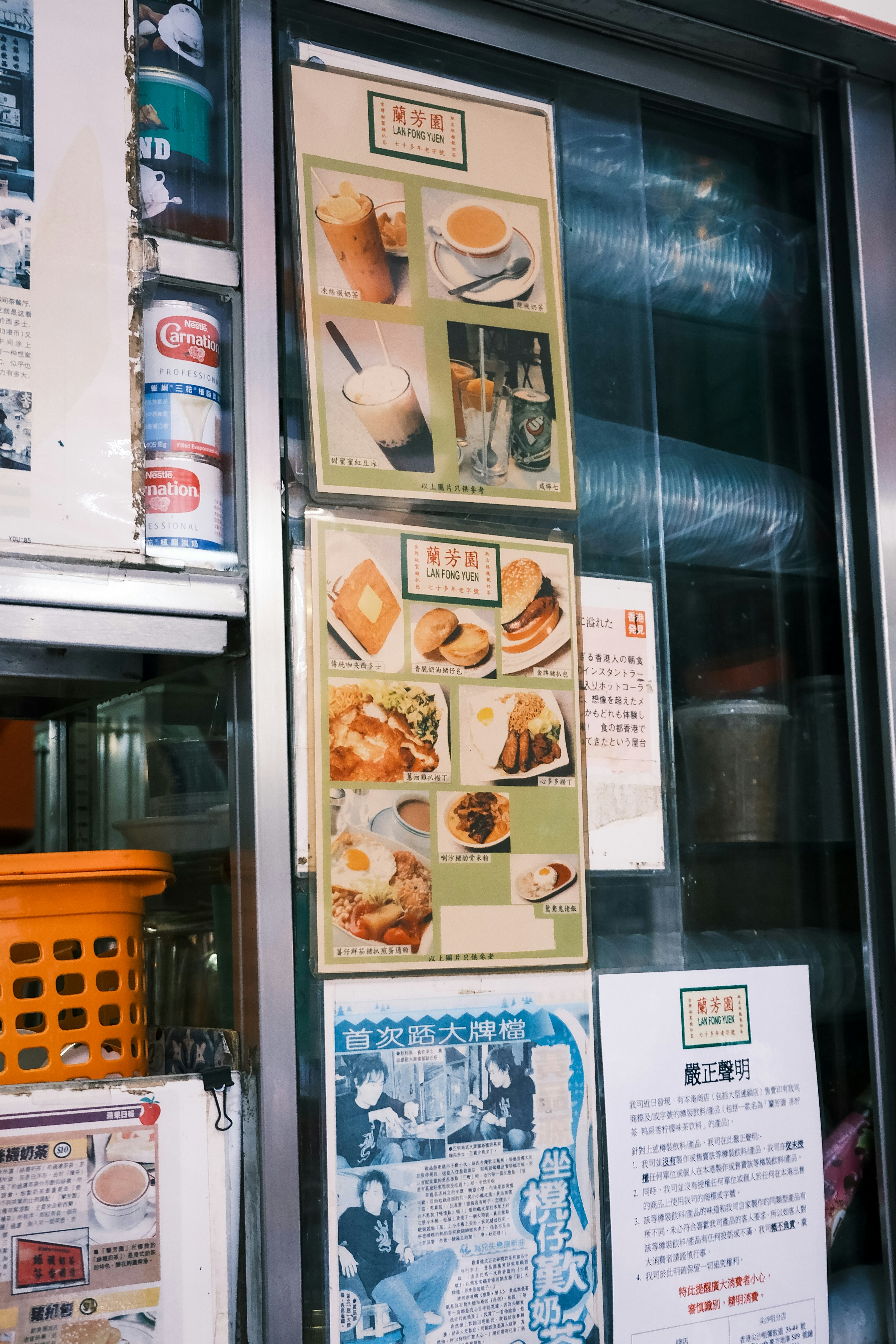 Behind the Glass: A Street-Level Menu Mosaic of Drinks and Pastries