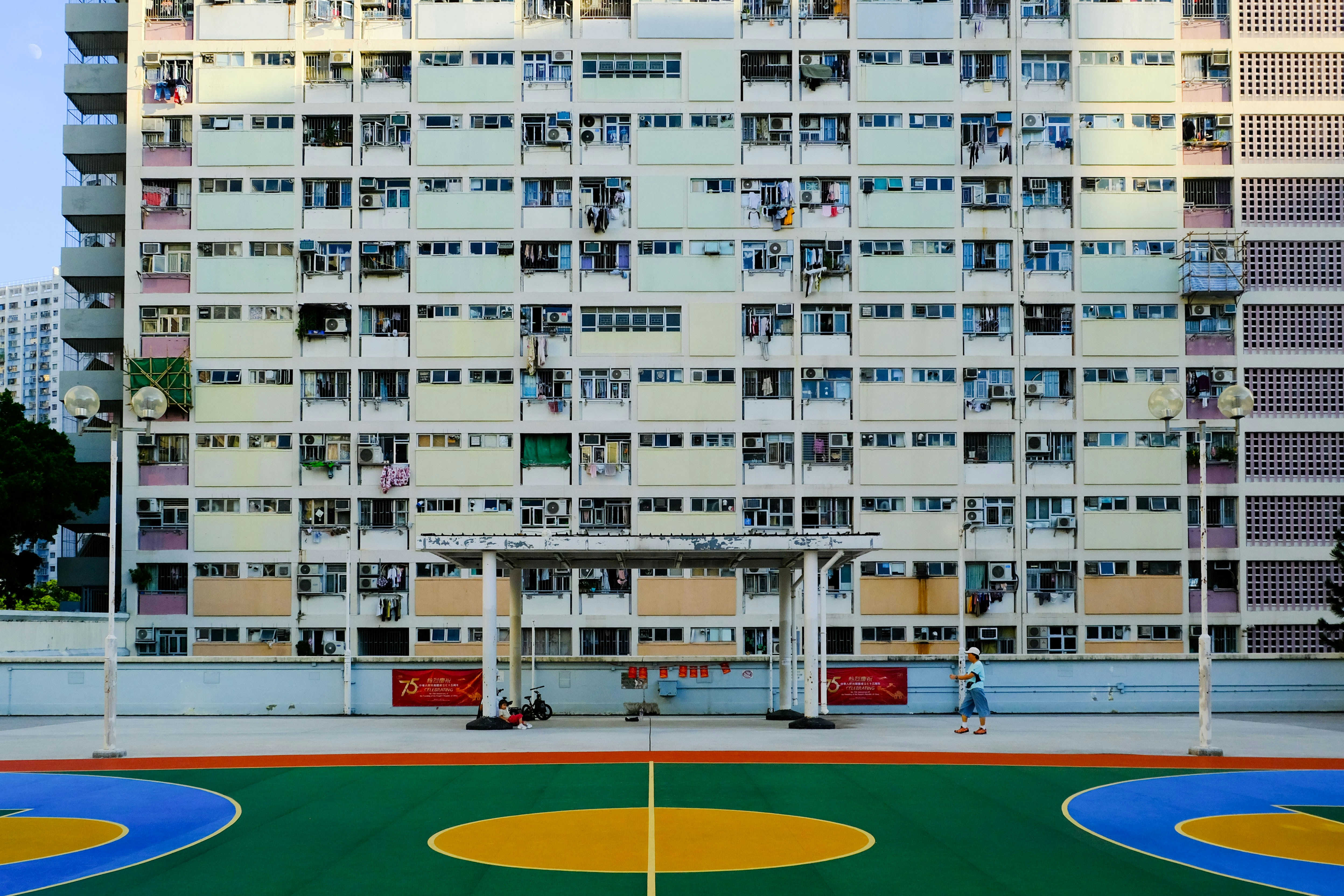 Grid of Balconies Meets Circular Court: An Urban Facade Portrait