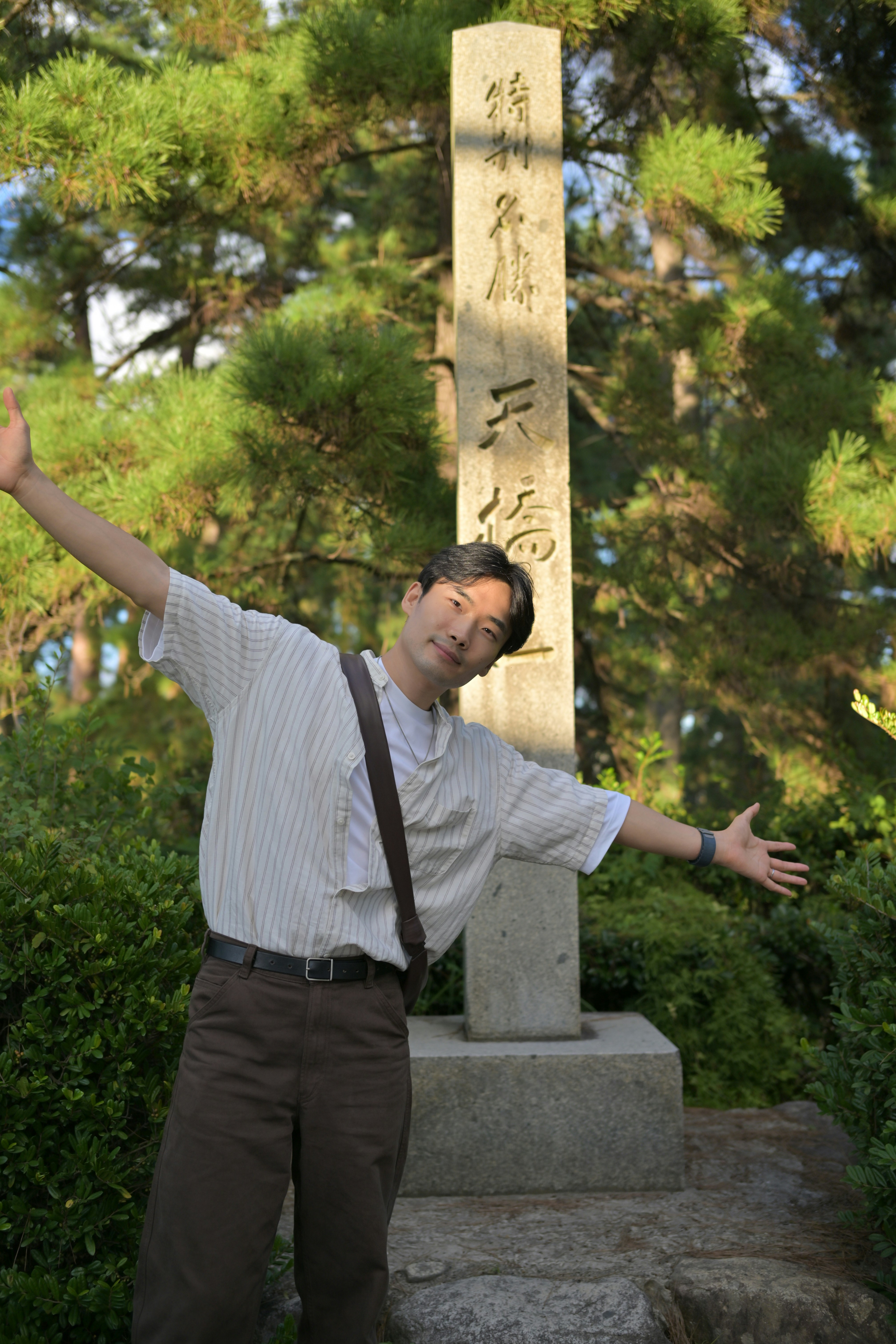 A man standing in front of a monument photo – Free Amanohashidate Image ...