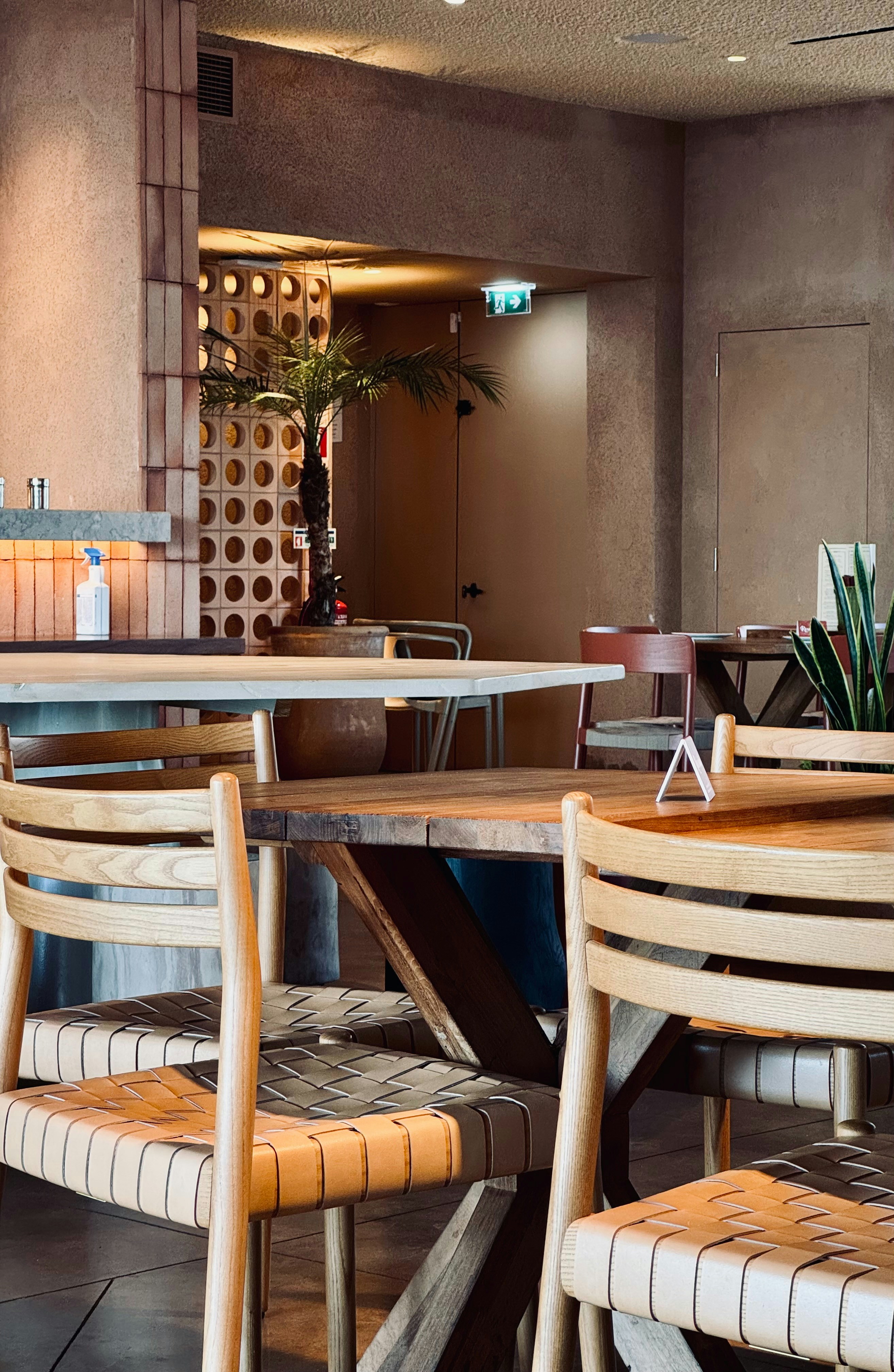 A restaurant with wooden tables and chairs photo – Free Interior design ...