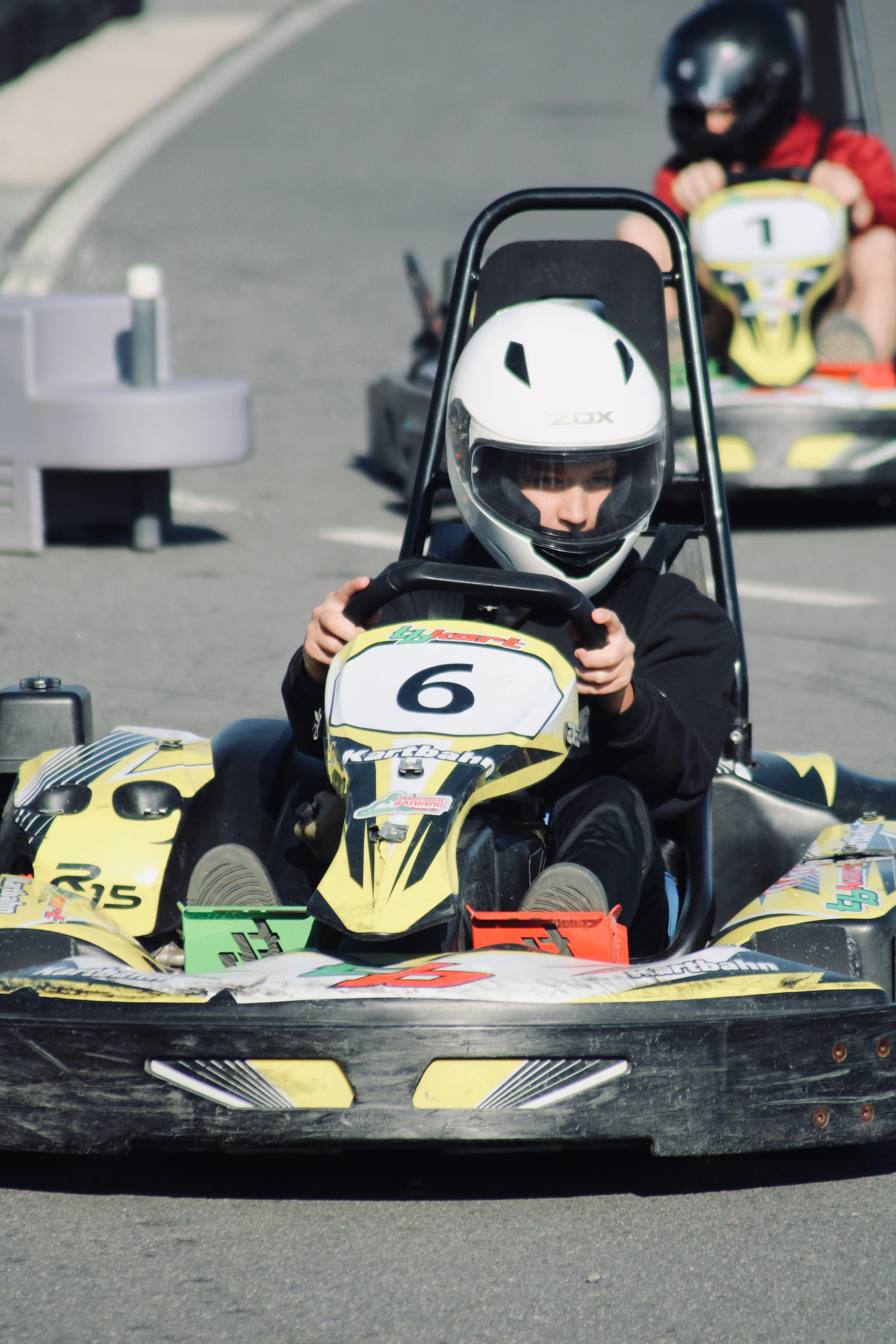 A couple of people that are in a go kart photo – Free Portrait Image on ...