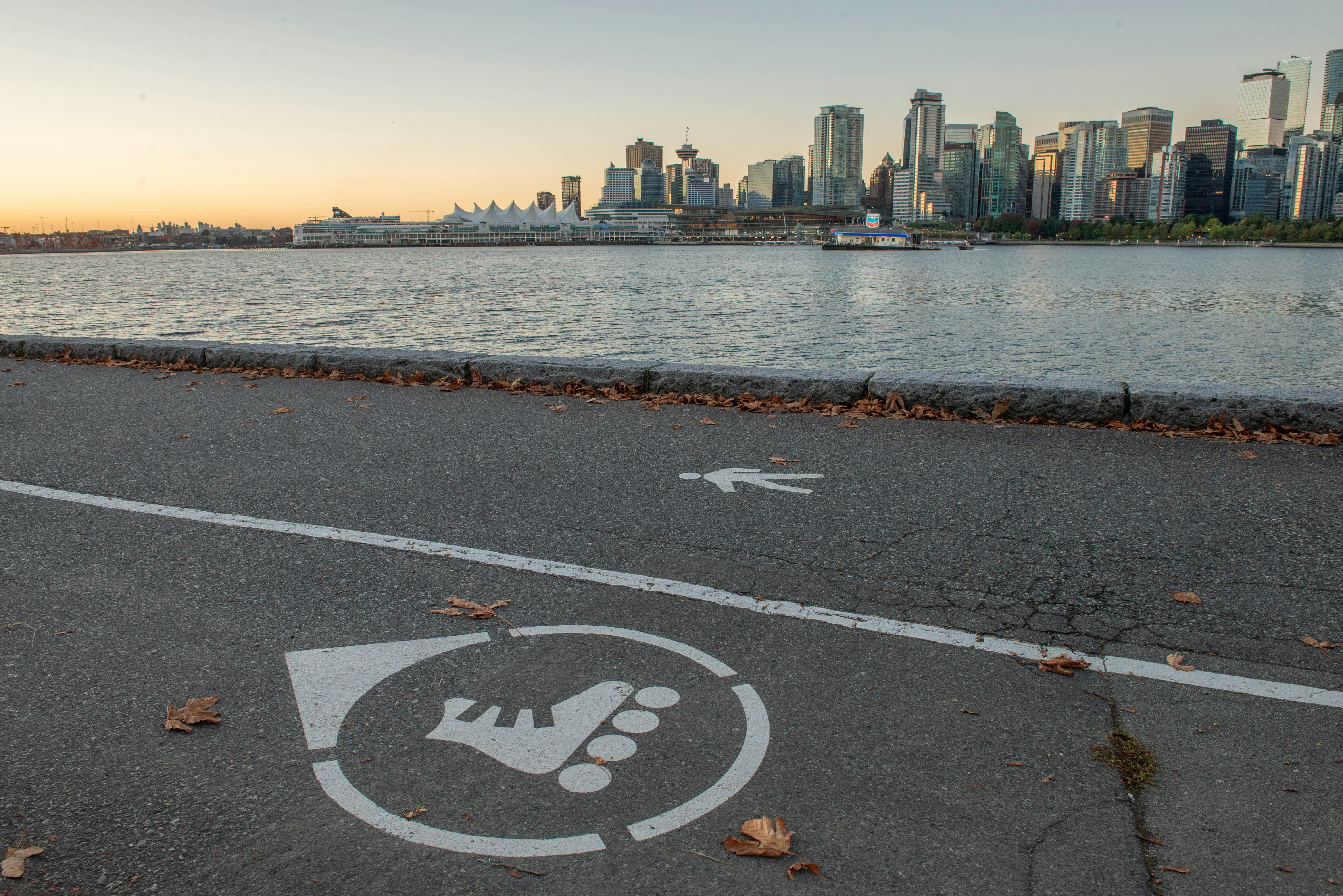 Circular Emblem on the Waterfront Promenade at Sunset