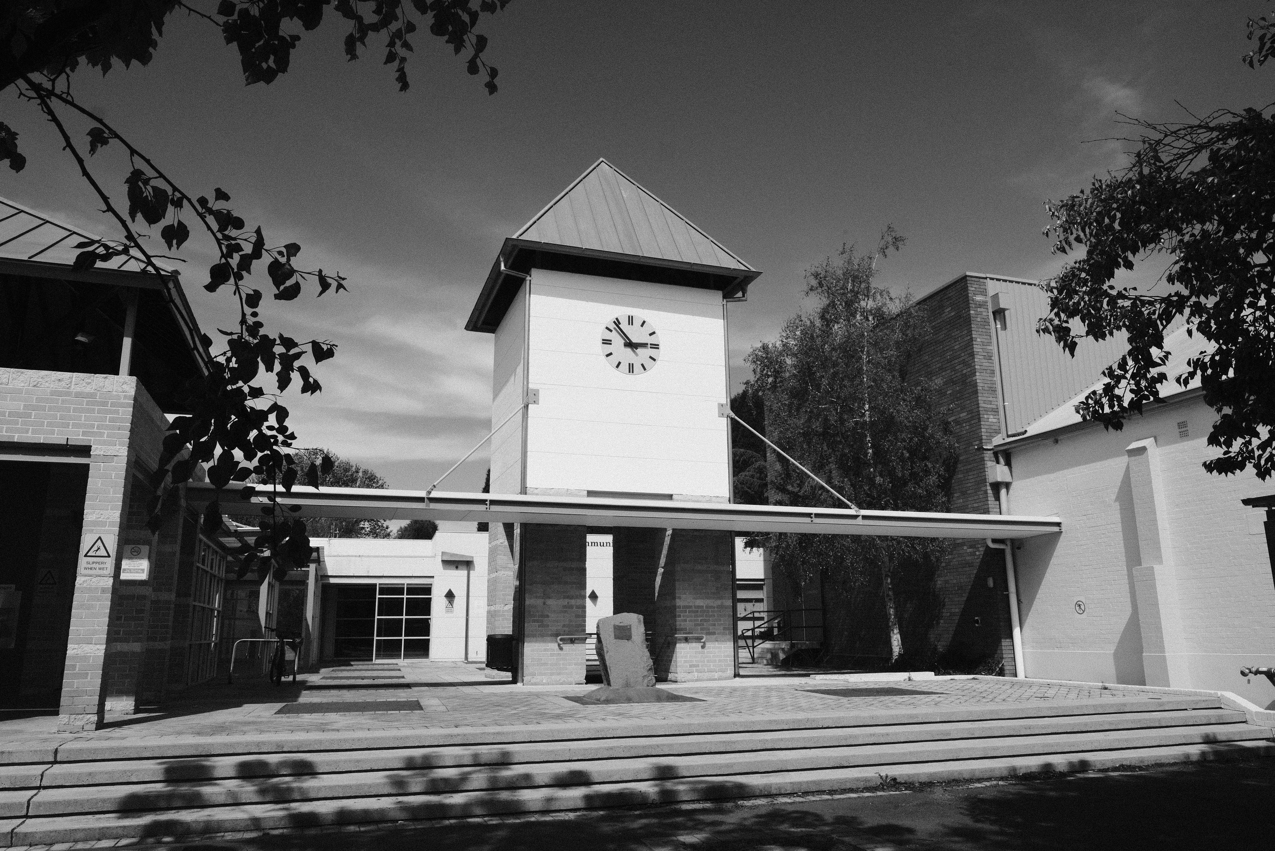Clocktower on the Stairs: A Quiet Campus Facade in Monochrome