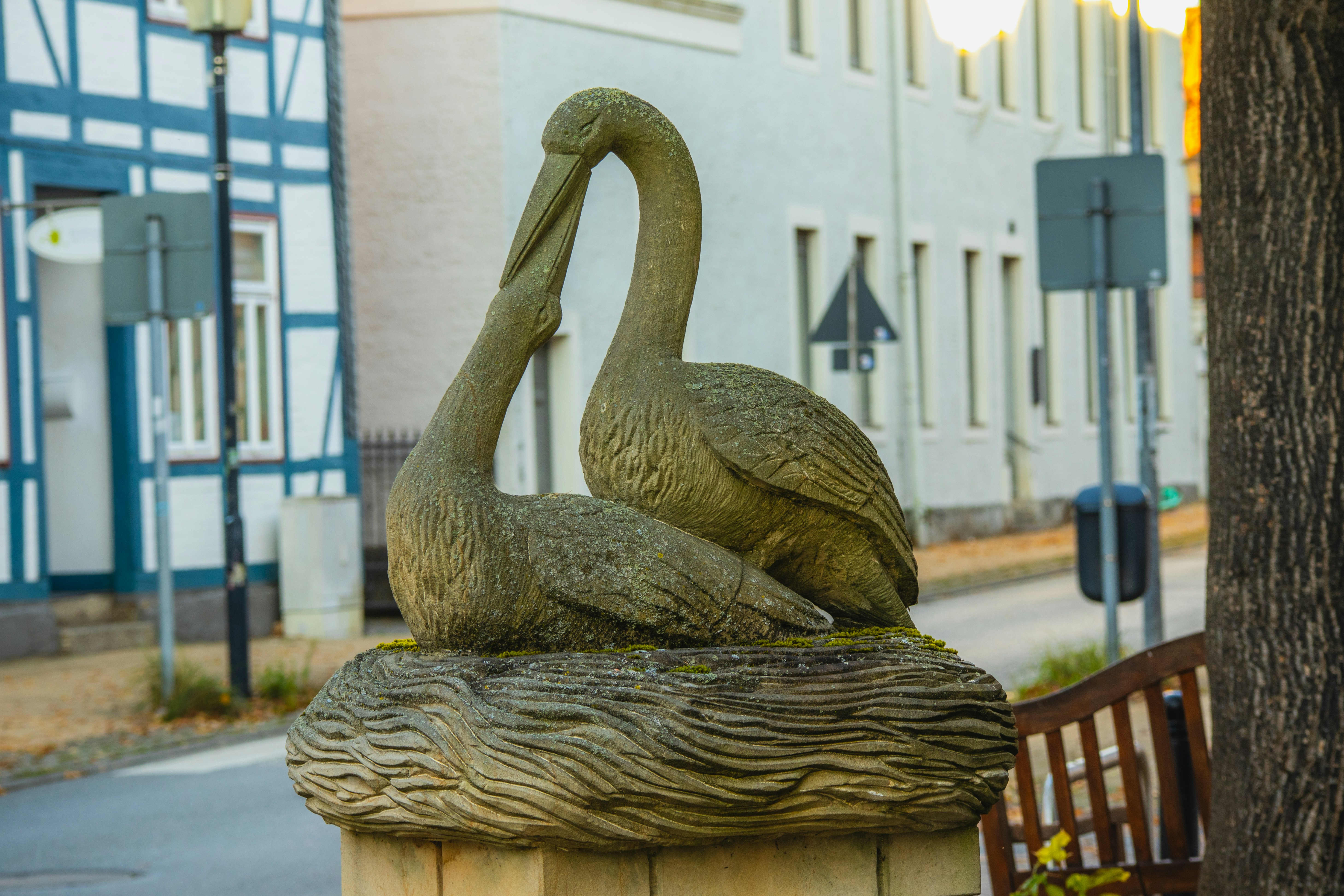 Twin Pelican Statues Guard the Quiet Town Square