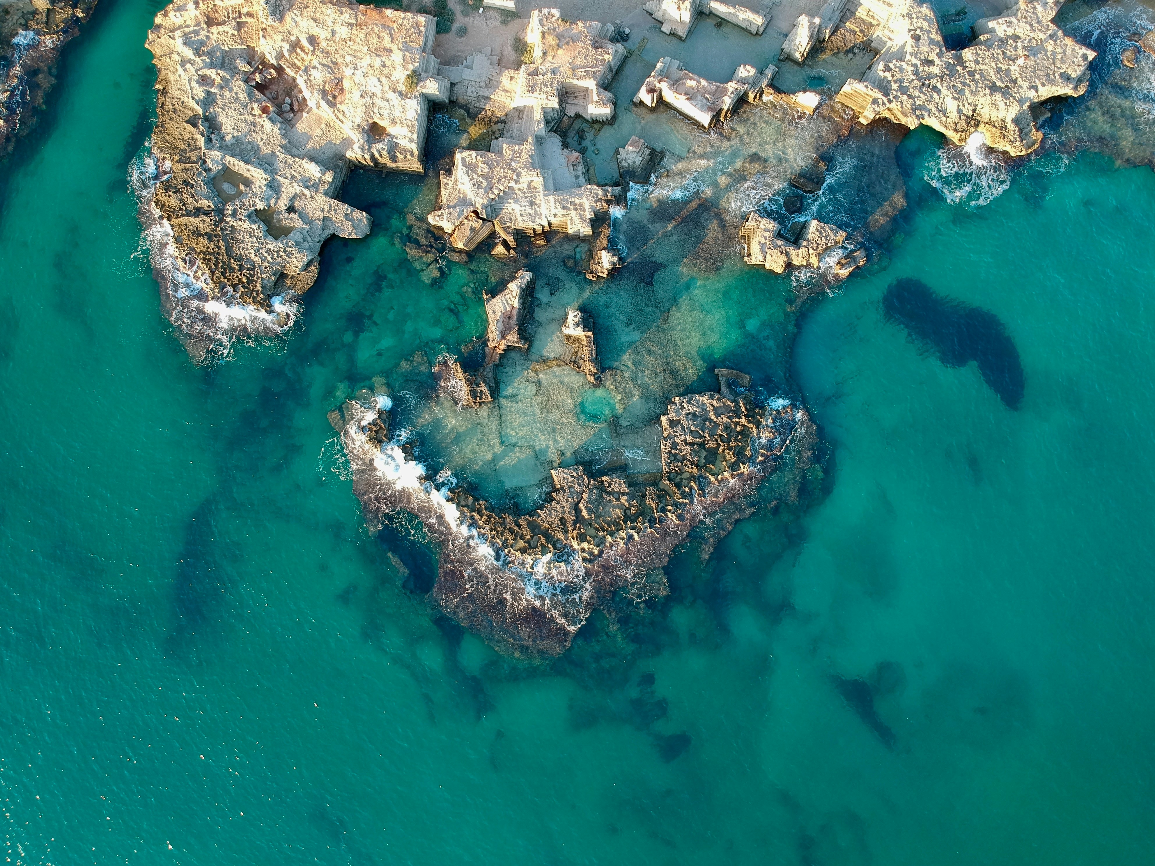 Turquoise Cove Geometry: Rugged Rocks Meet Clear Shallows