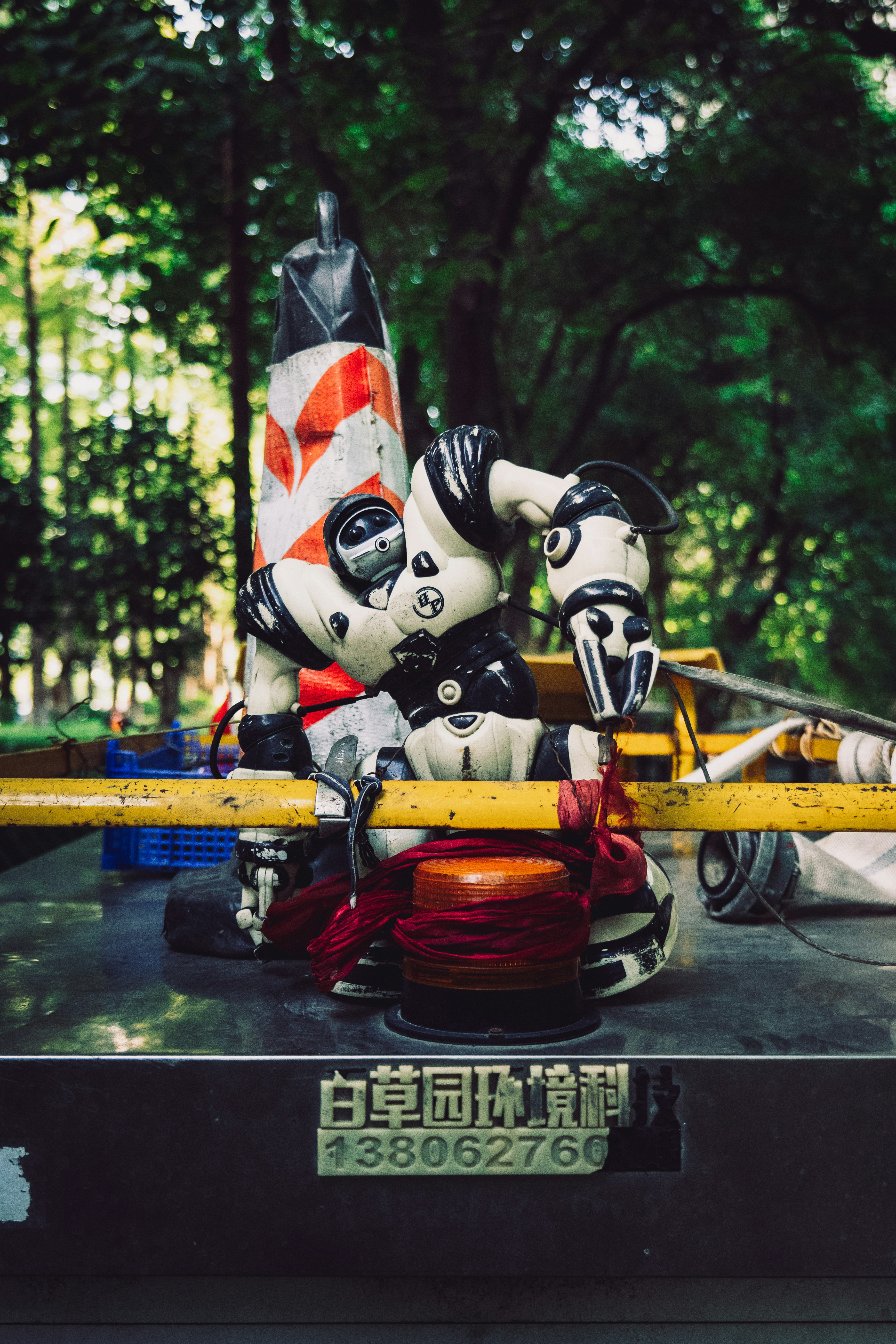 Parkyard Automaton: Retro-Futurist Robot Amid Construction Gear