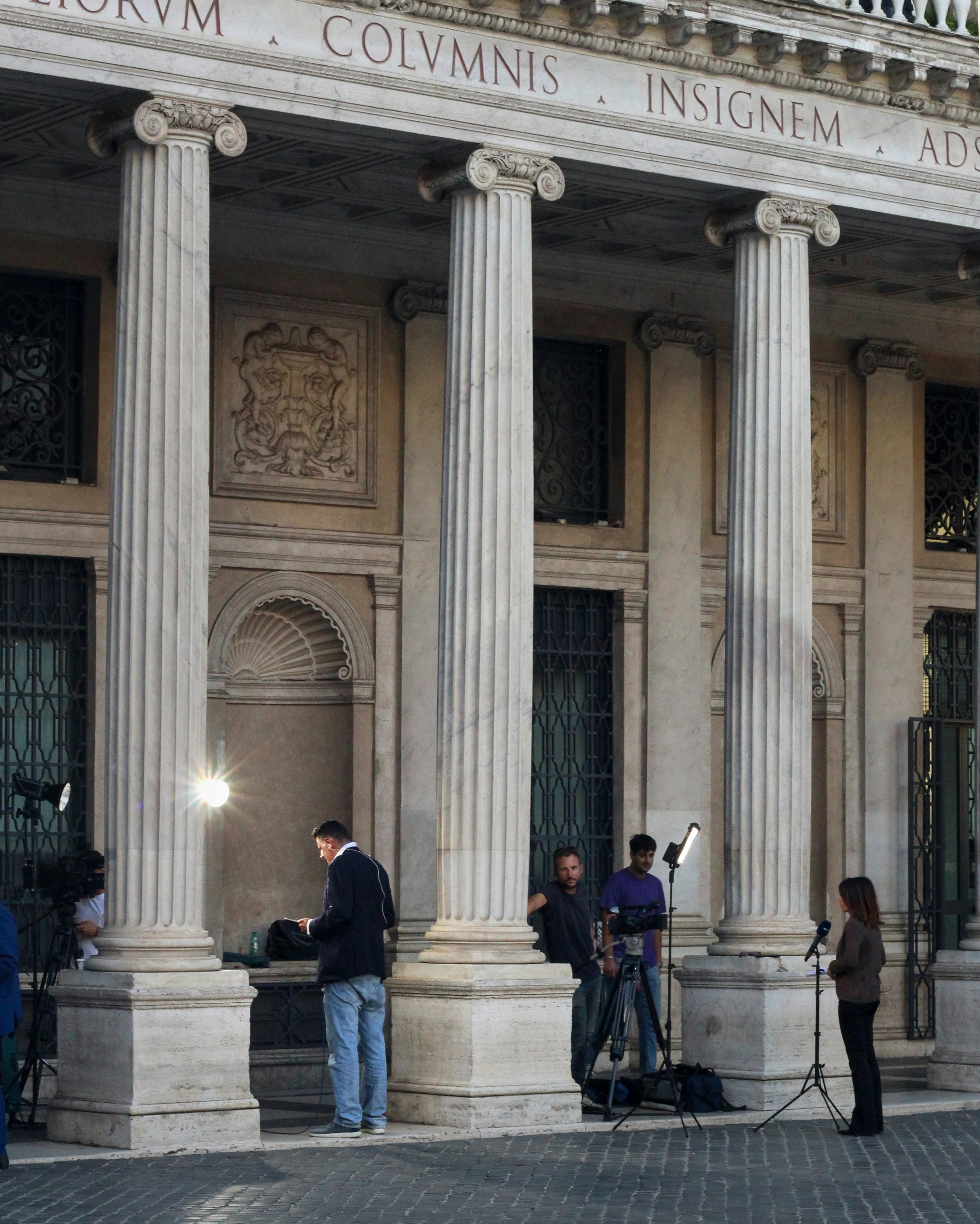 A group of people standing outside of a building photo – Free Building ...
