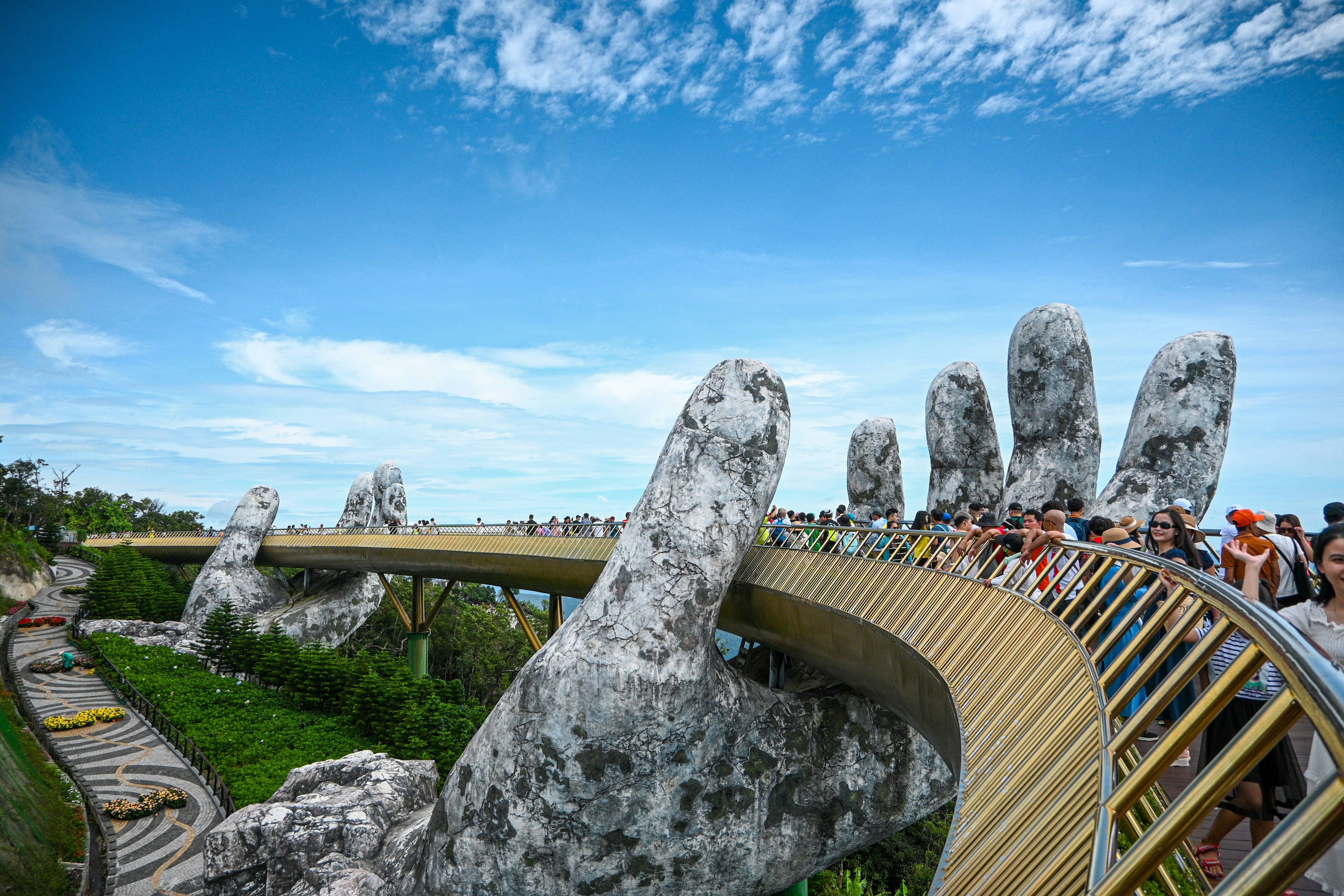 Palm Bridge: A Golden Walk Across Giant Stone Hands