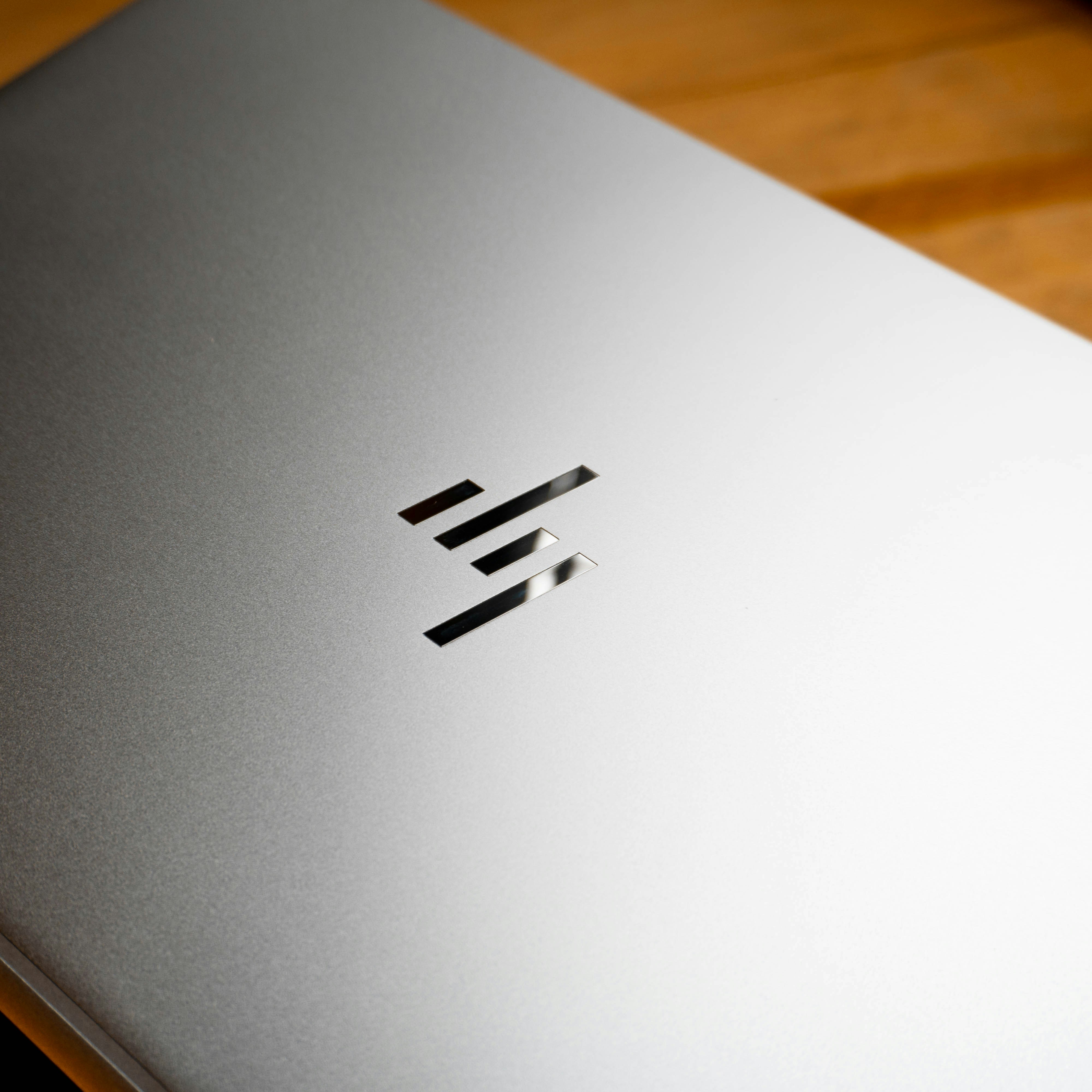A close up of a laptop on a wooden table photo – Free Computer Image on ...
