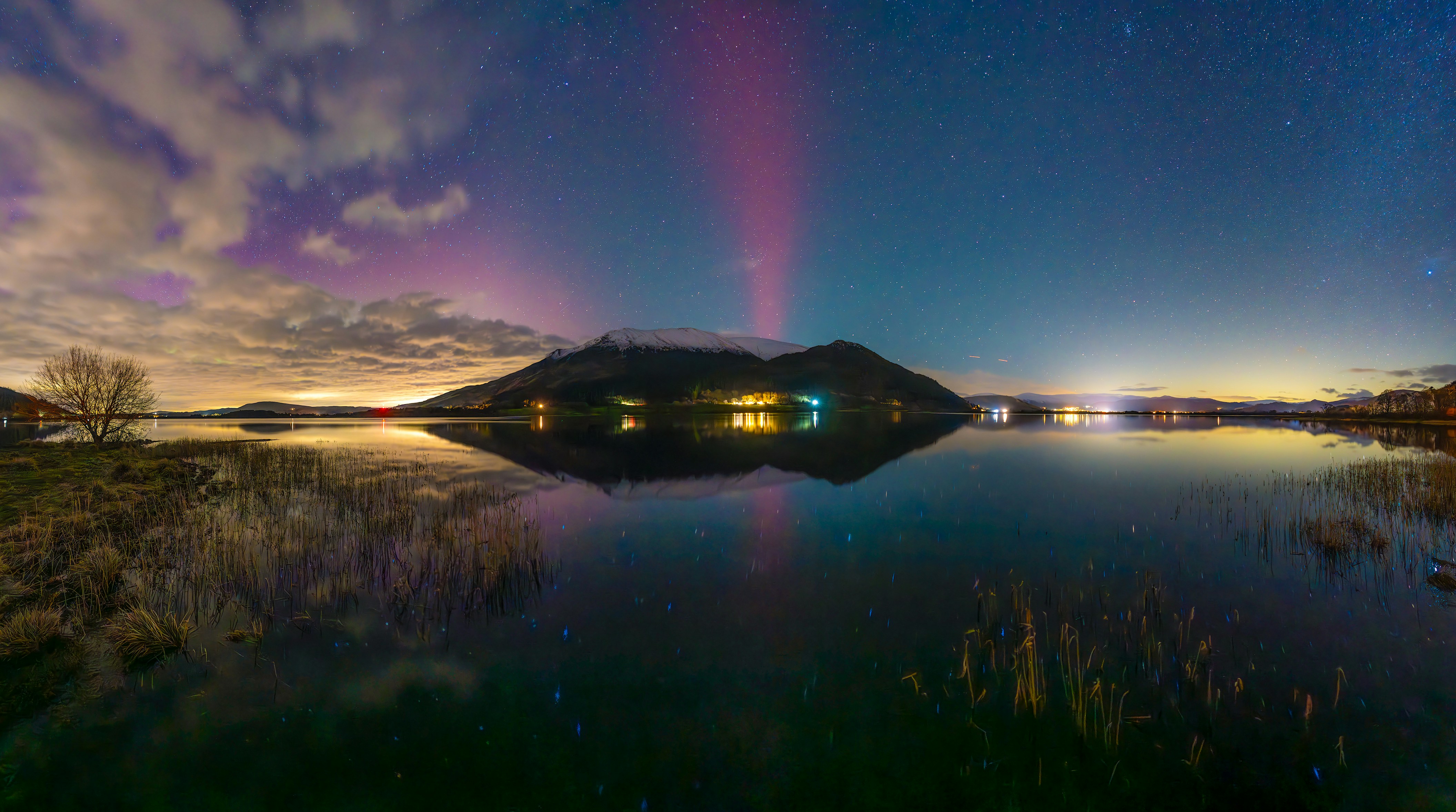 A lake with a lot of water and a lot of lights in the sky photo – Free ...