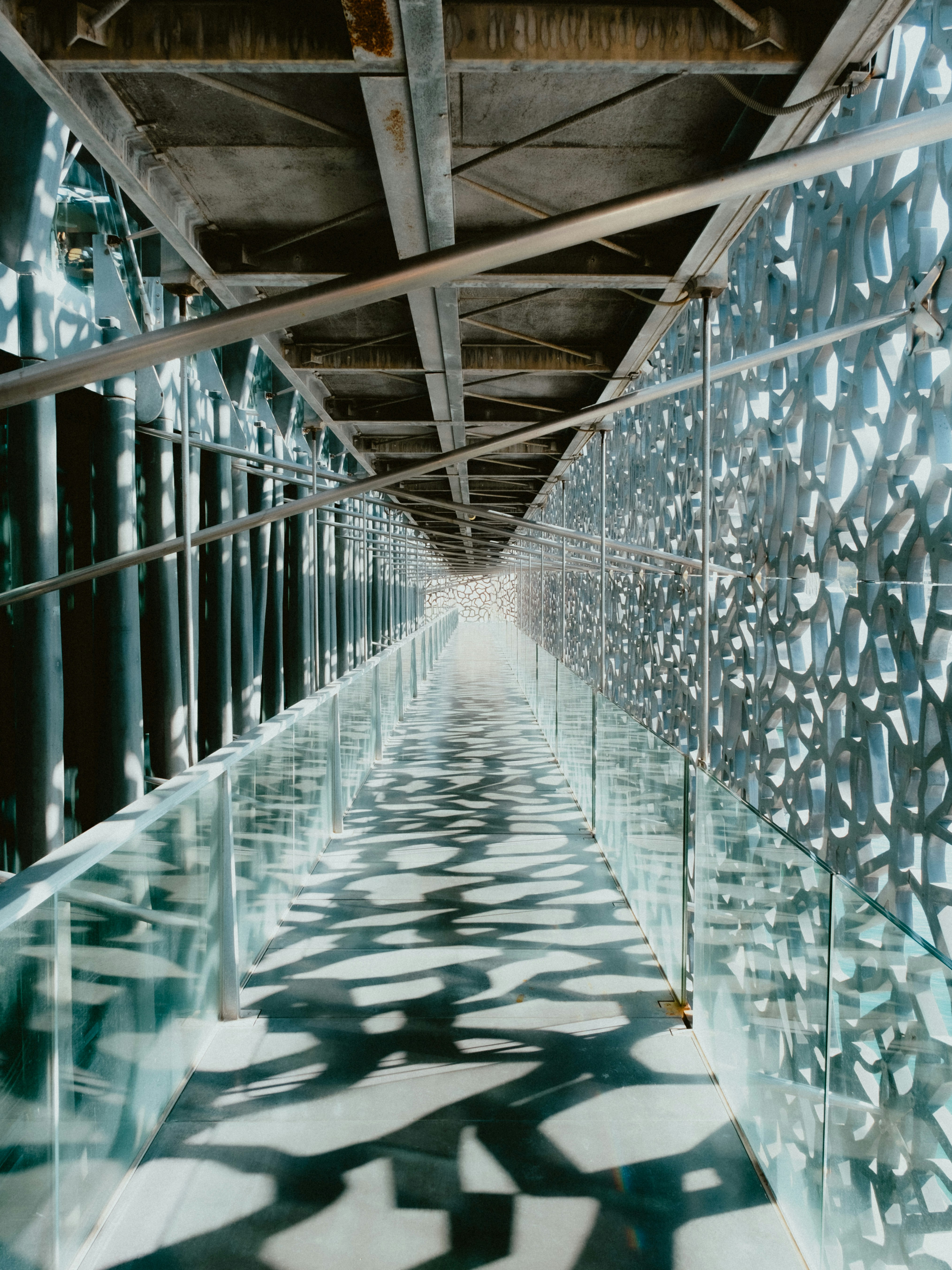 A very long walkway with lots of mirrors on it photo – Free France ...