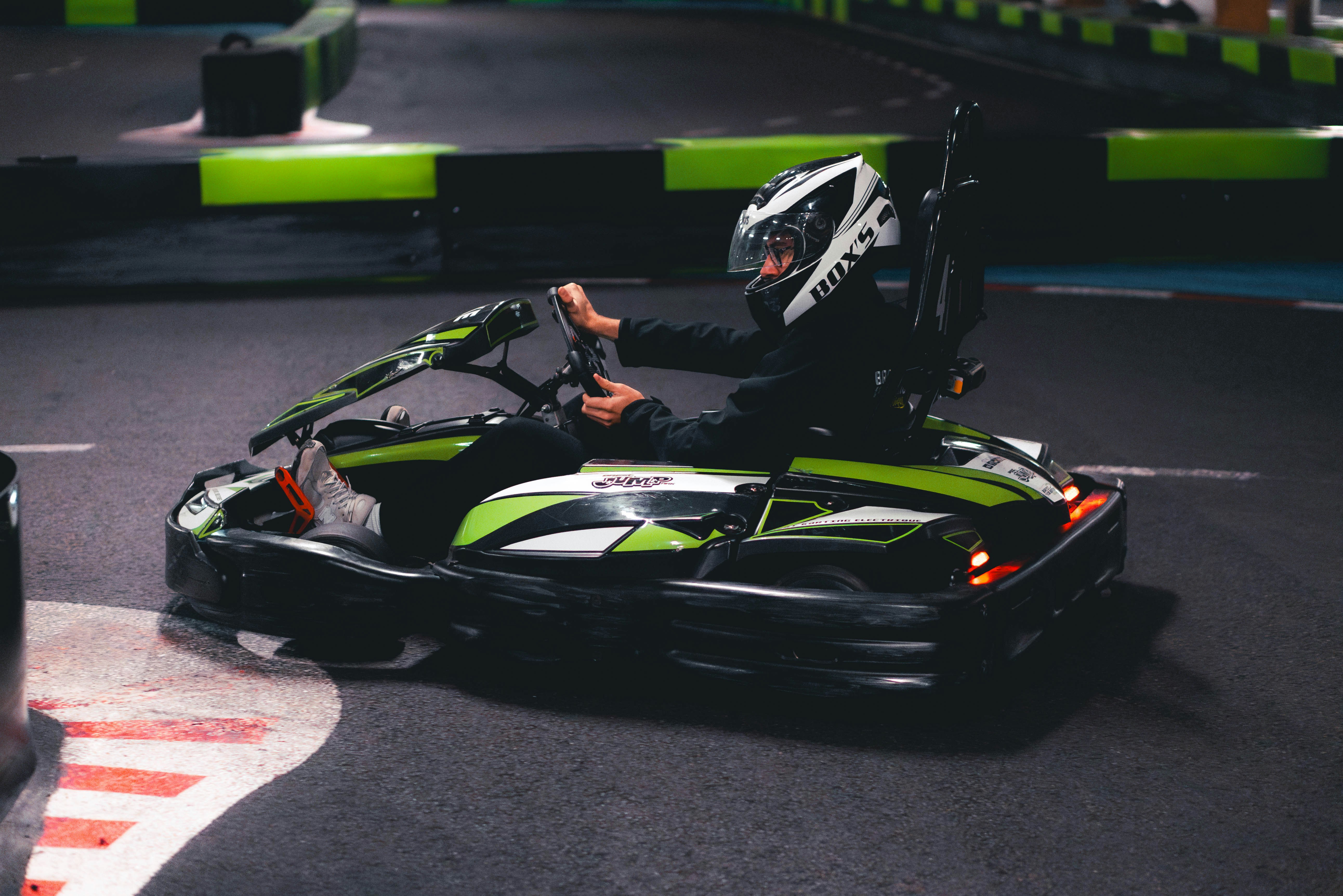 Neon-Accented Go-Kart in a Dim Indoor Arena