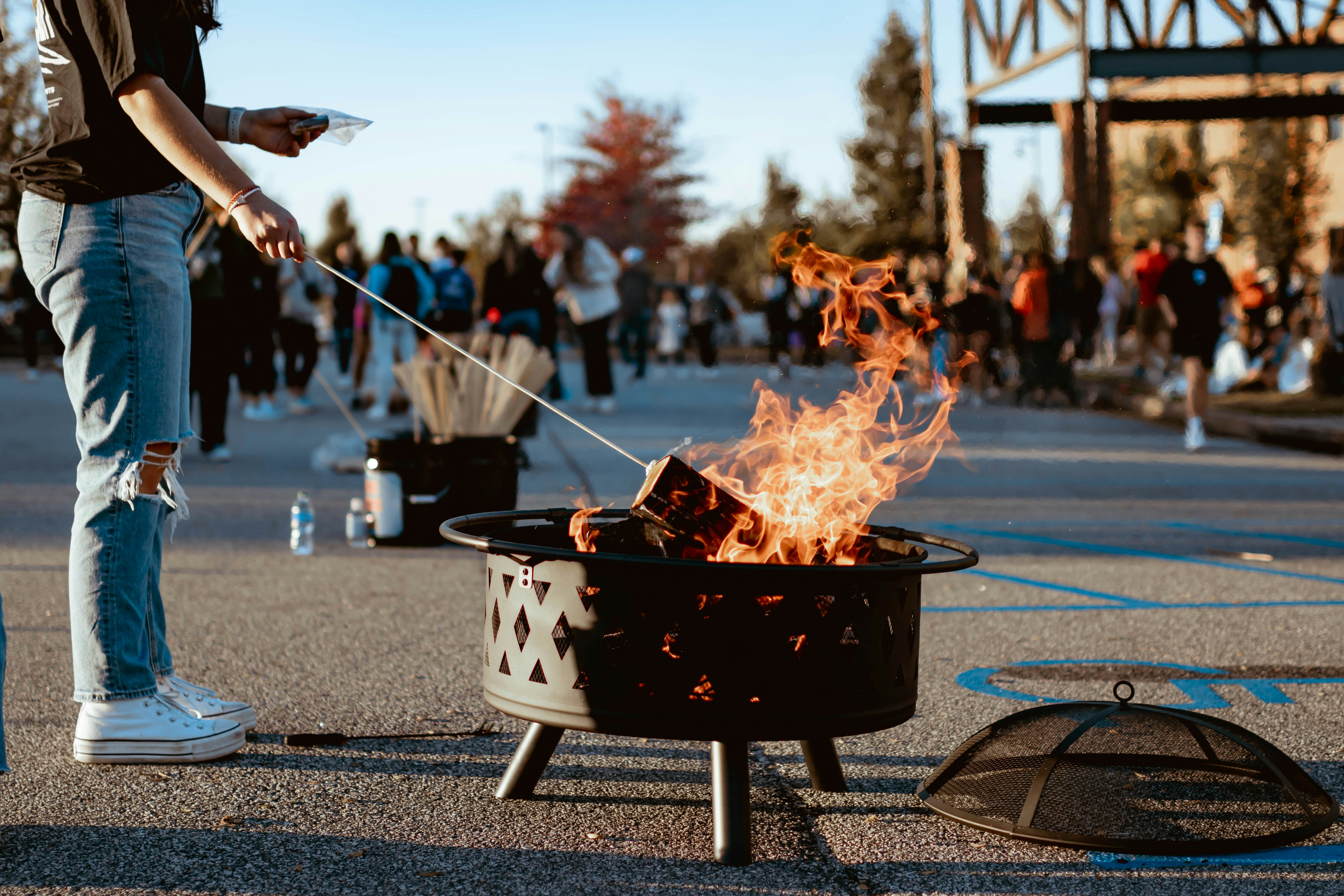 Opening Night Fire: People Gather as Flames Crackle in a Community Courtyard