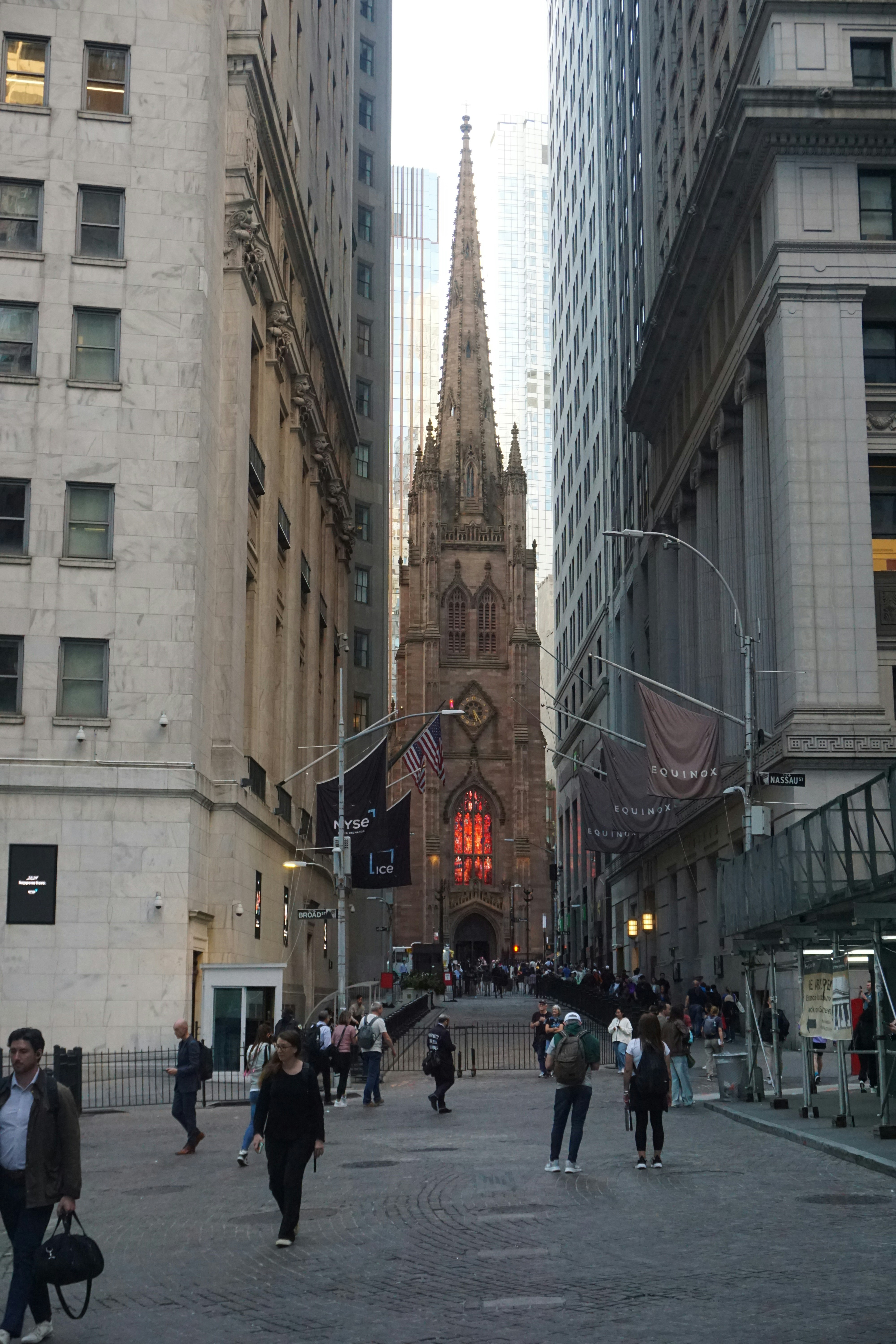 Manhattan Convergence: A Gothic Spire Framed by Skyscrapers
