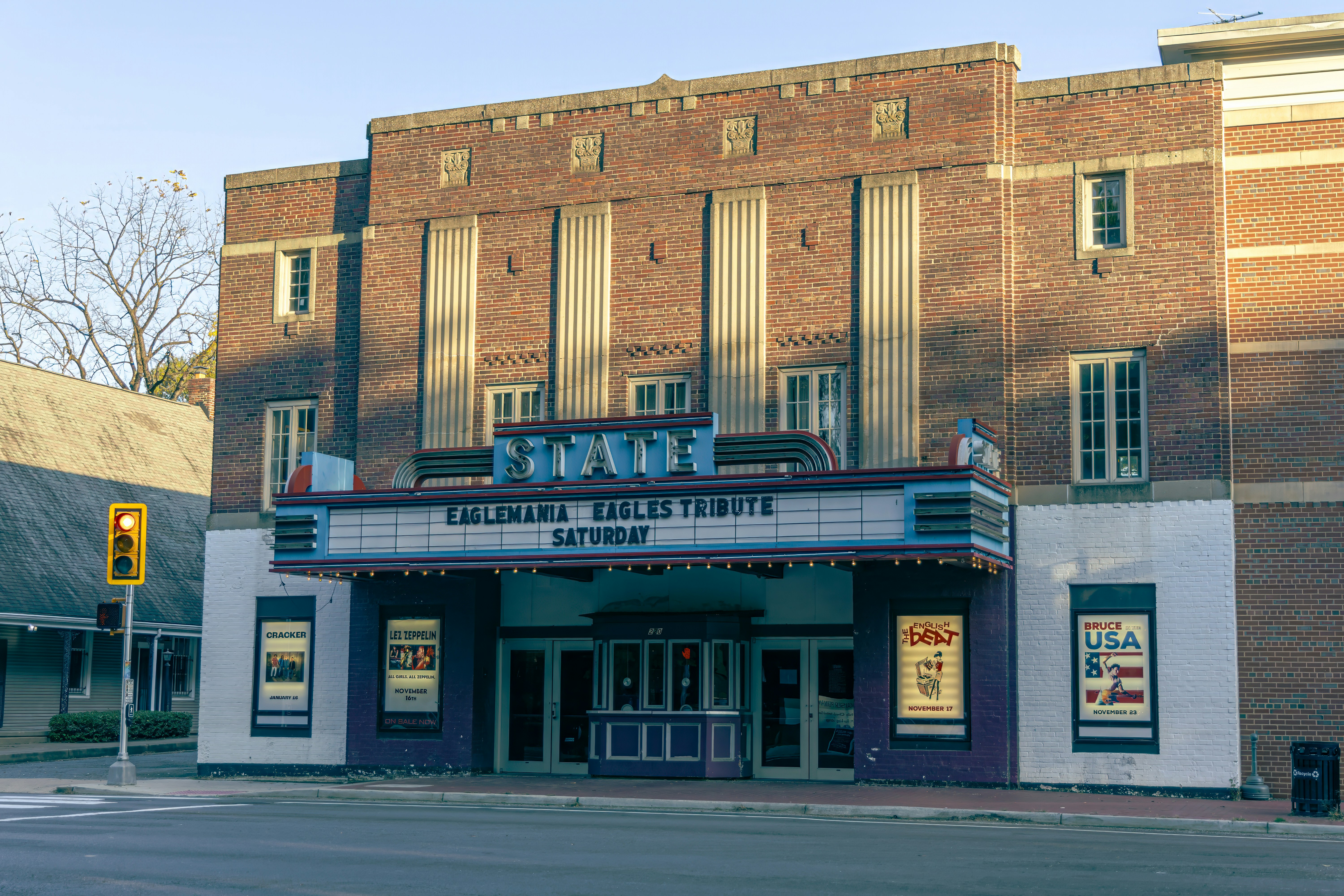 A movie theater on the corner of a street photo – Free Building Image ...